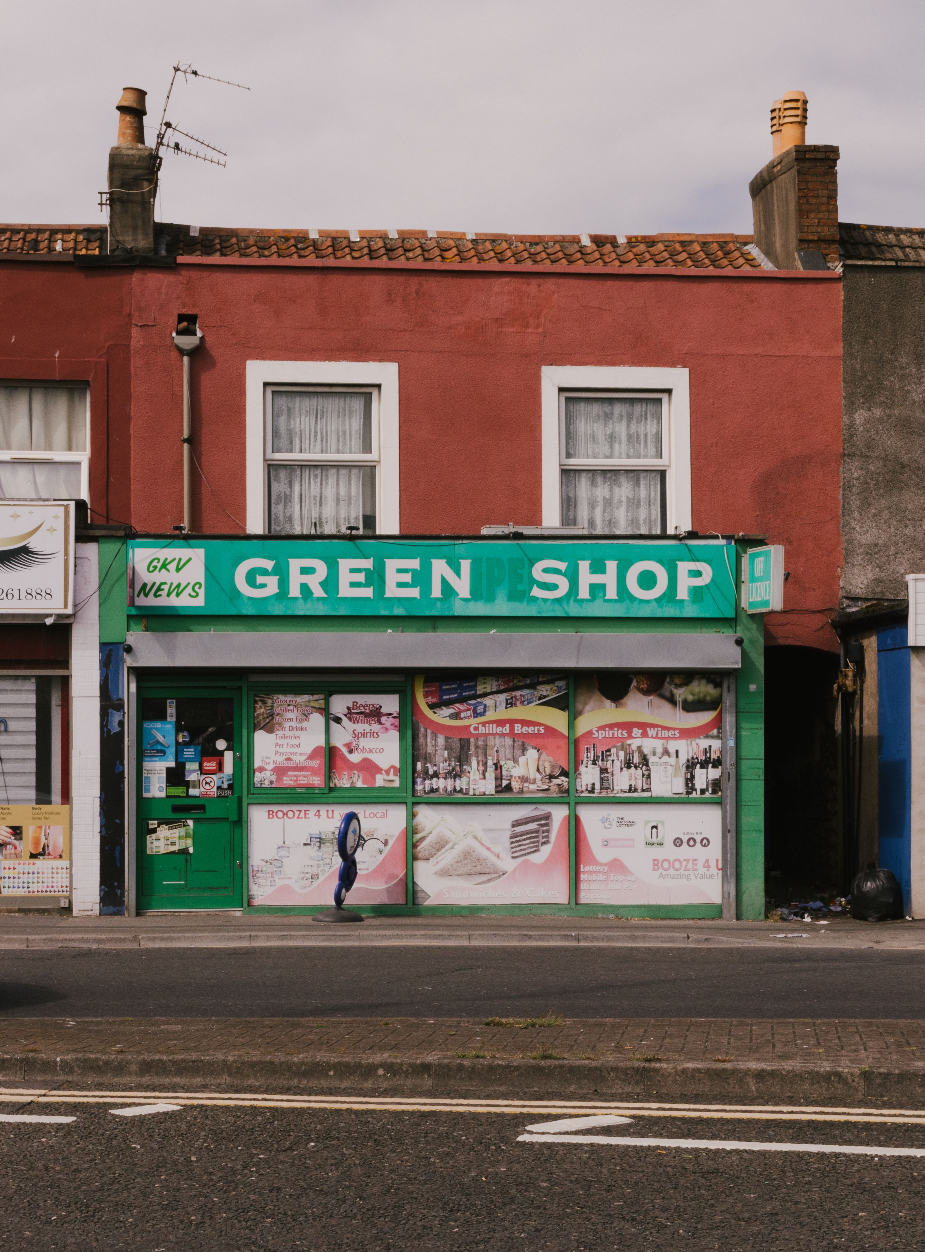 A green shop with a sign that says green shop · Free Stock Photo
