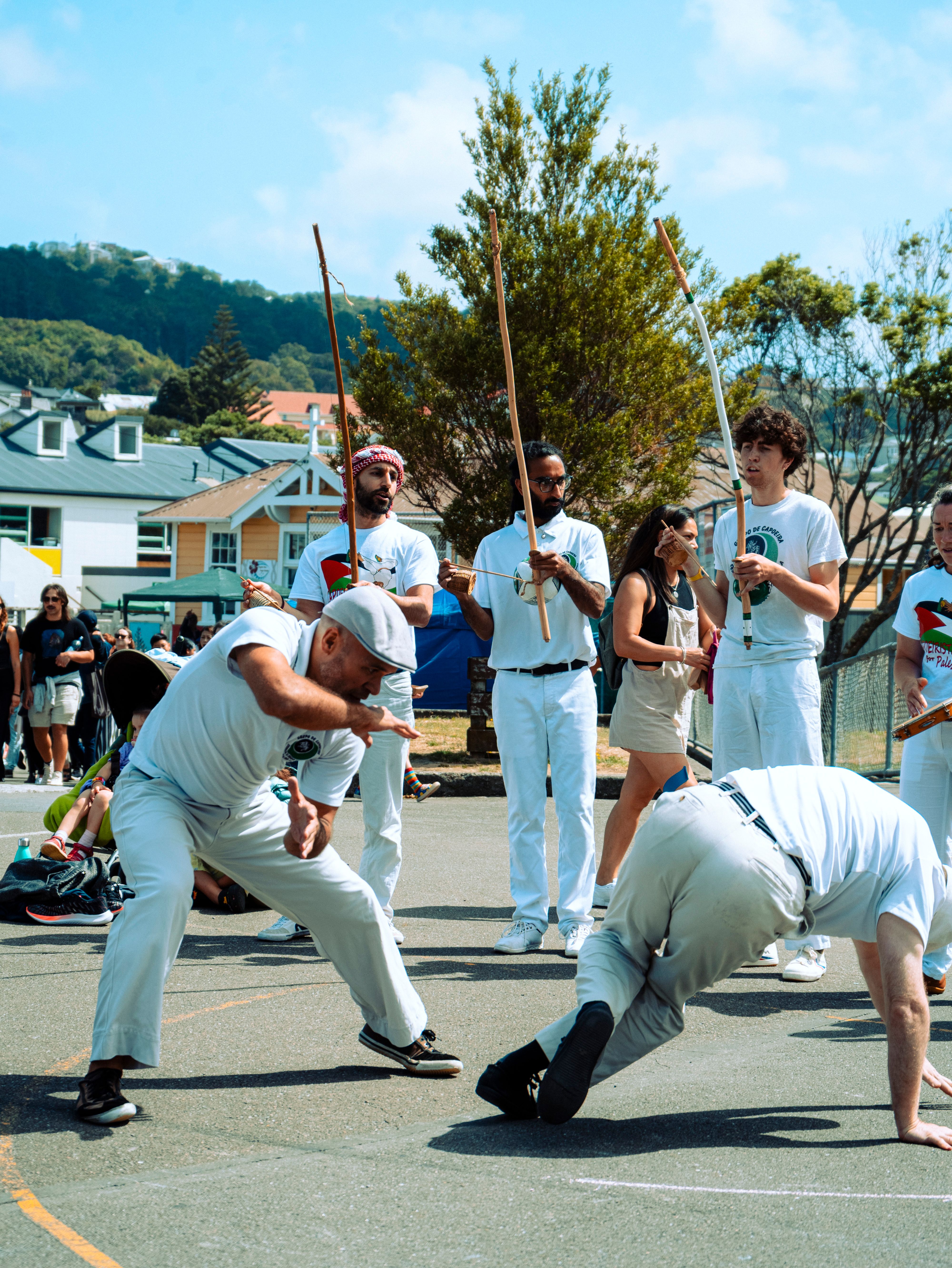 A group of people in white clothes doing tricks · Free Stock Photo