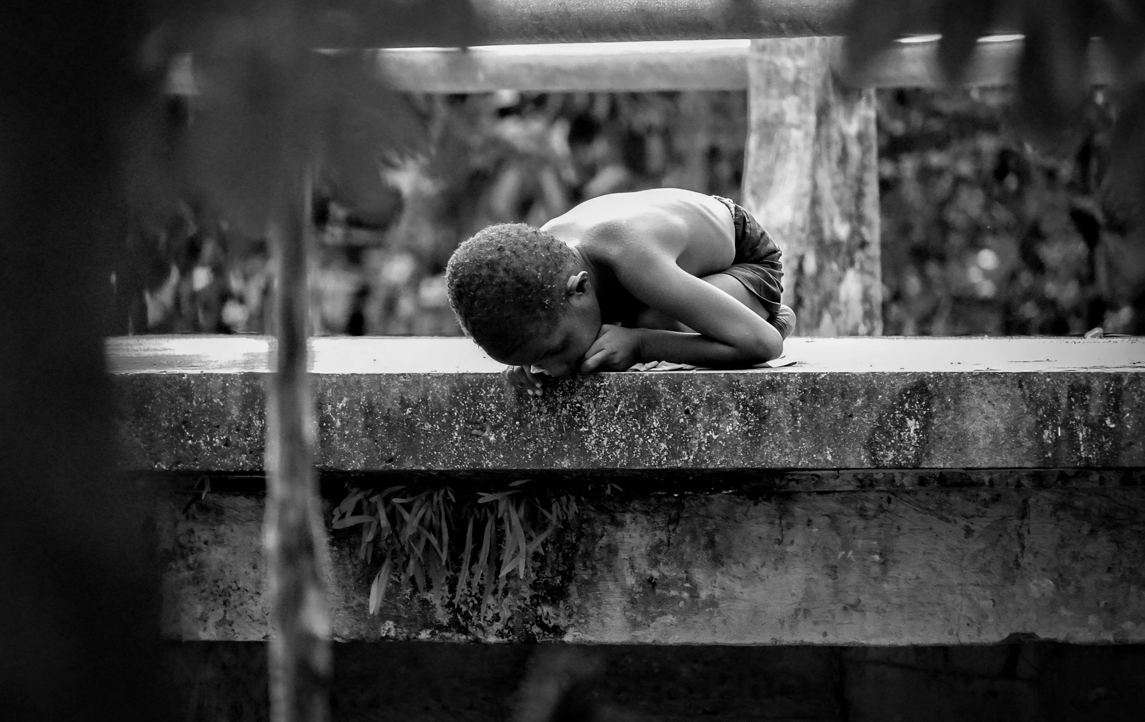 Kid Looking Down From the Bridge · Free Stock Photo