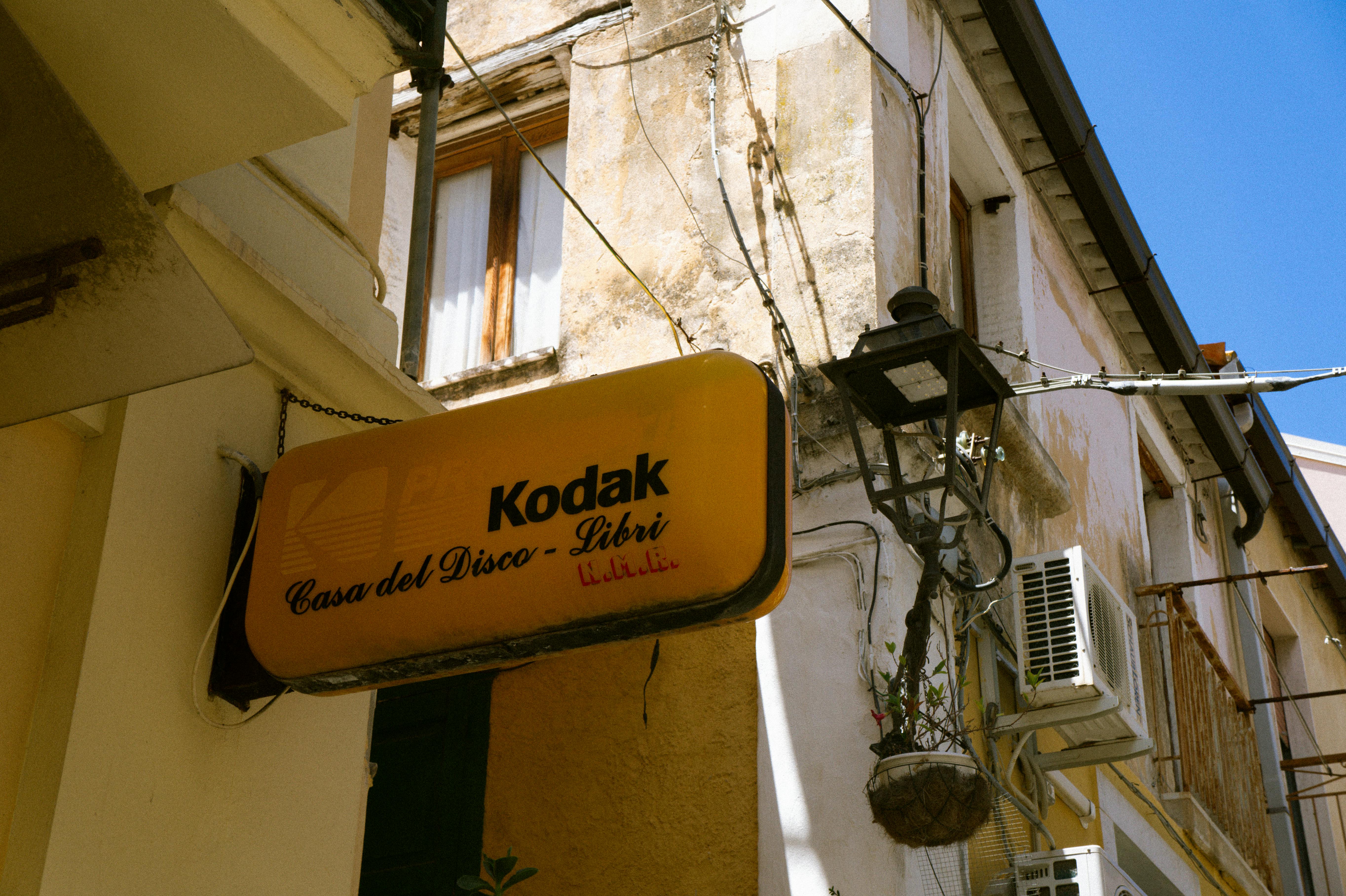 Kodak Sign in a Narrow Alley · Free Stock Photo