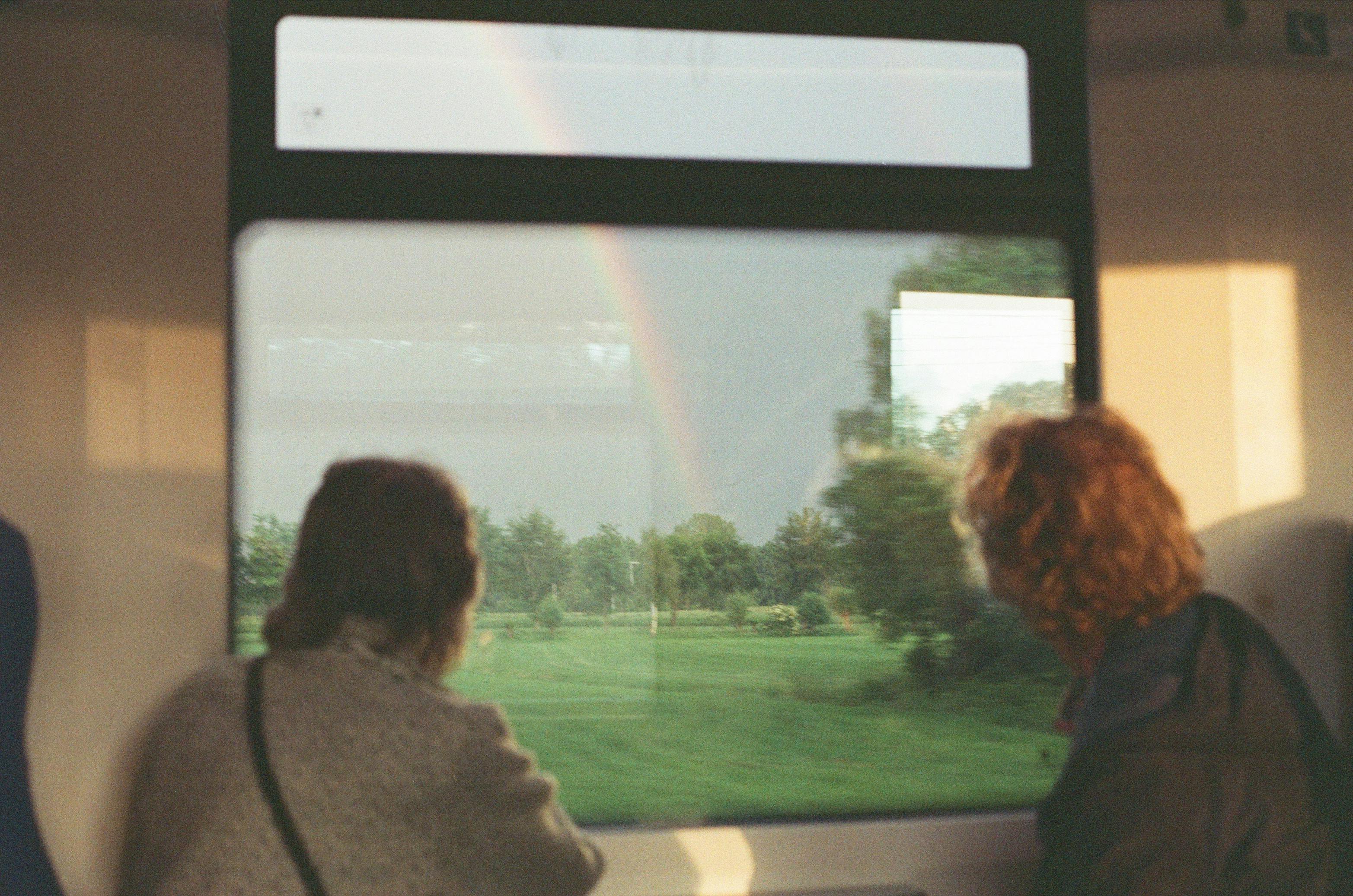 Film Photo of Women Looking Out the Train Window · Free Stock Photo