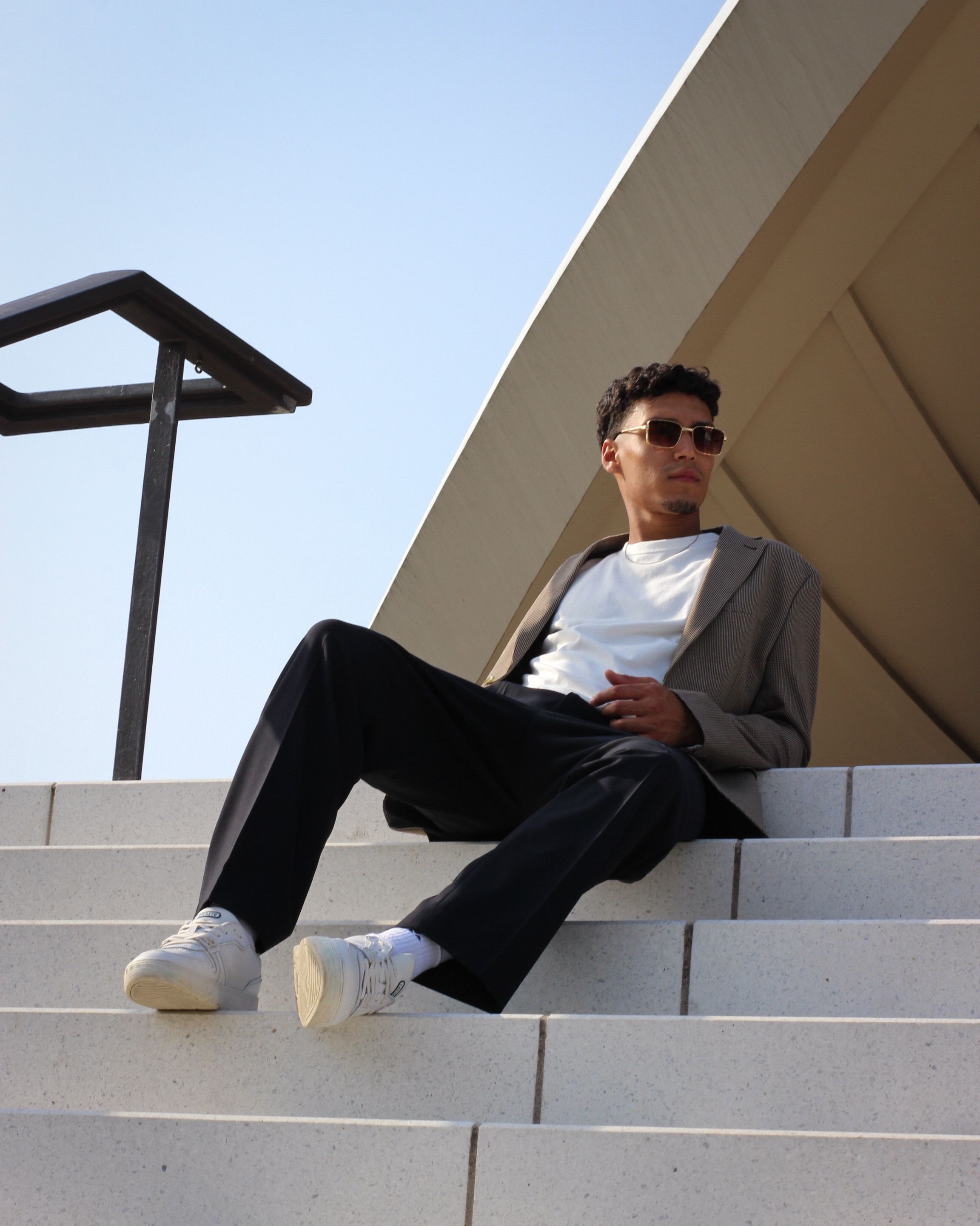 A Fashionable Man Sitting on the Steps · Free Stock Photo