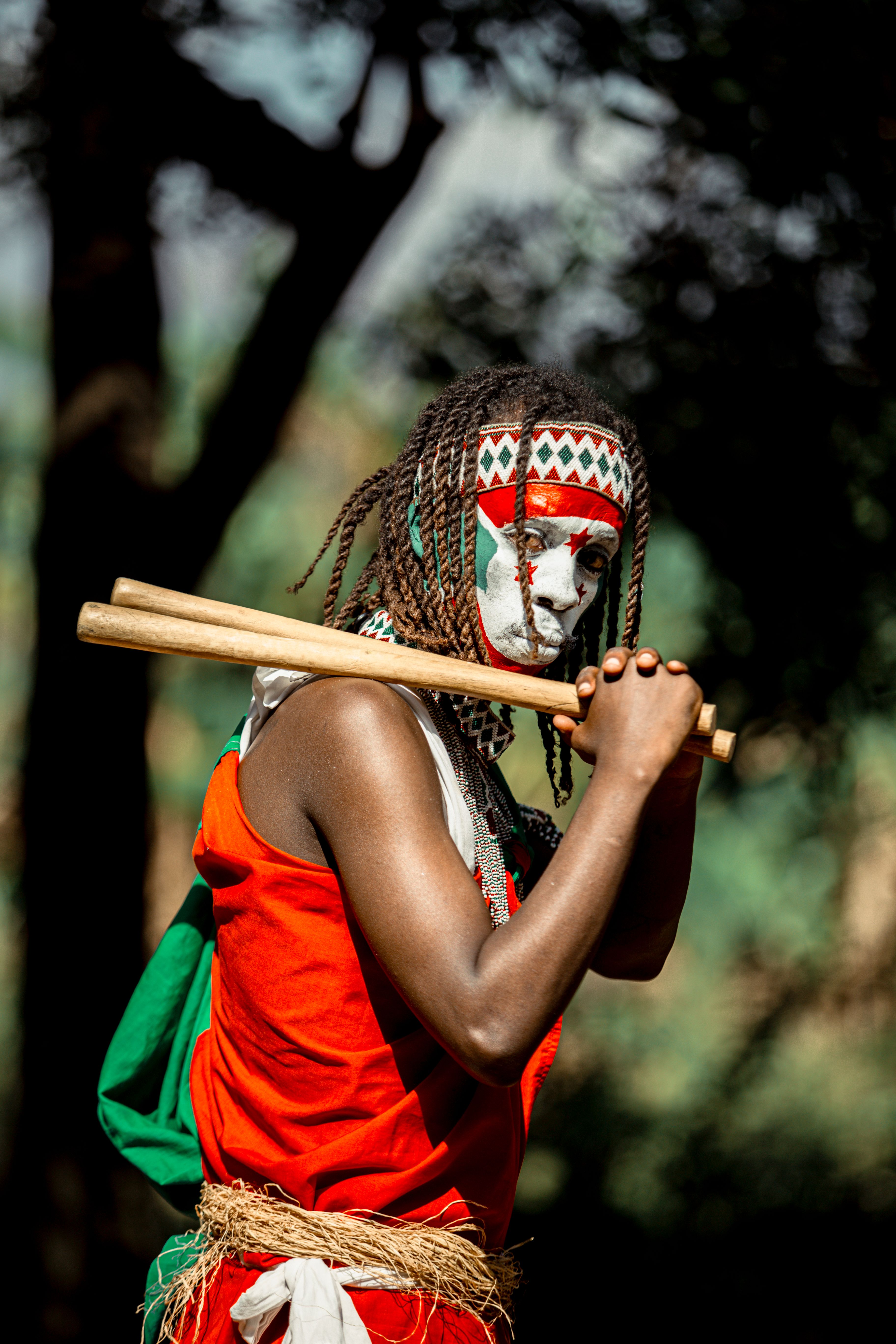 A Man with a Flag of Burundi Painted on His Face Posing Outside · Free ...