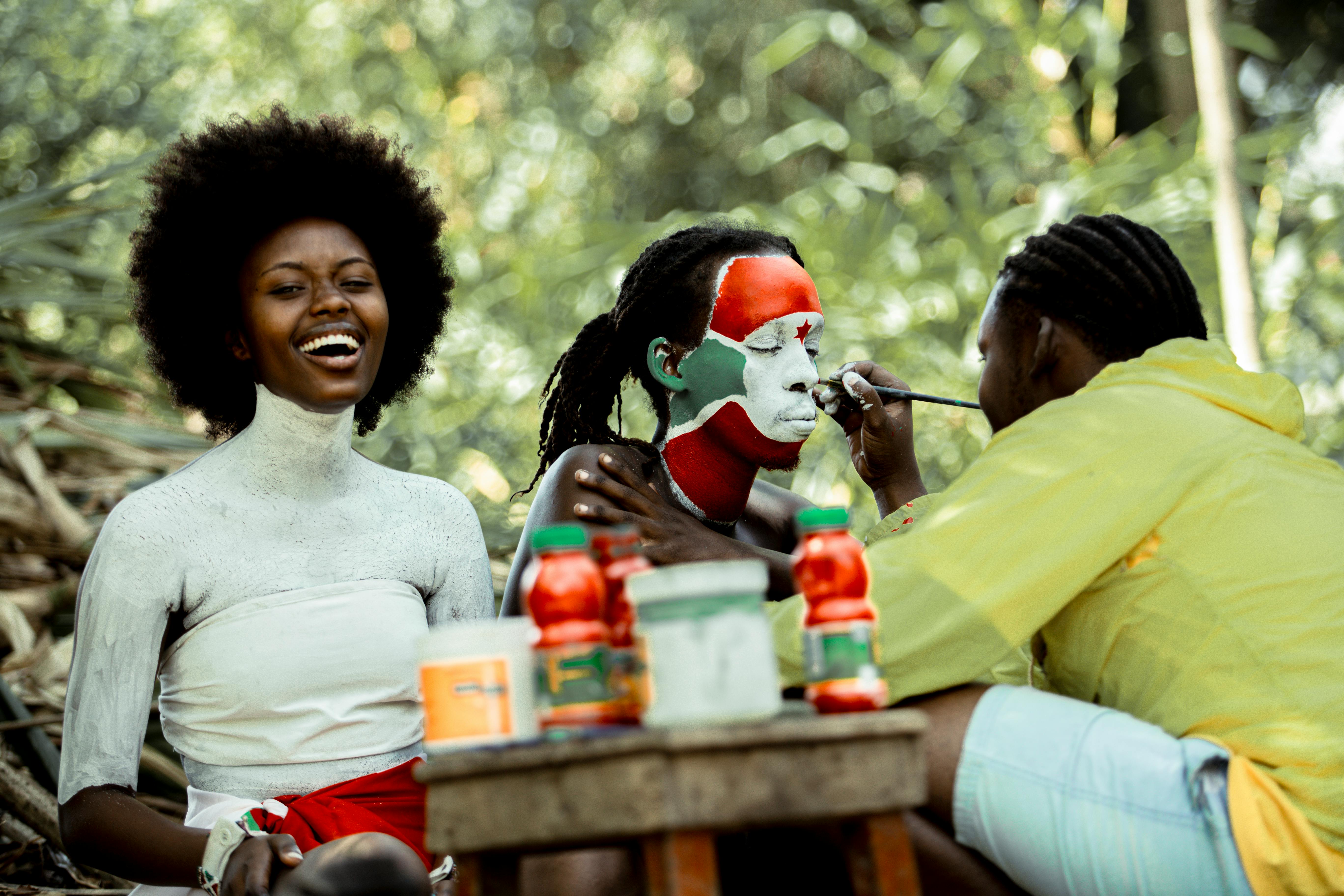 Cheerful Models Preparing before Photo Session · Free Stock Photo