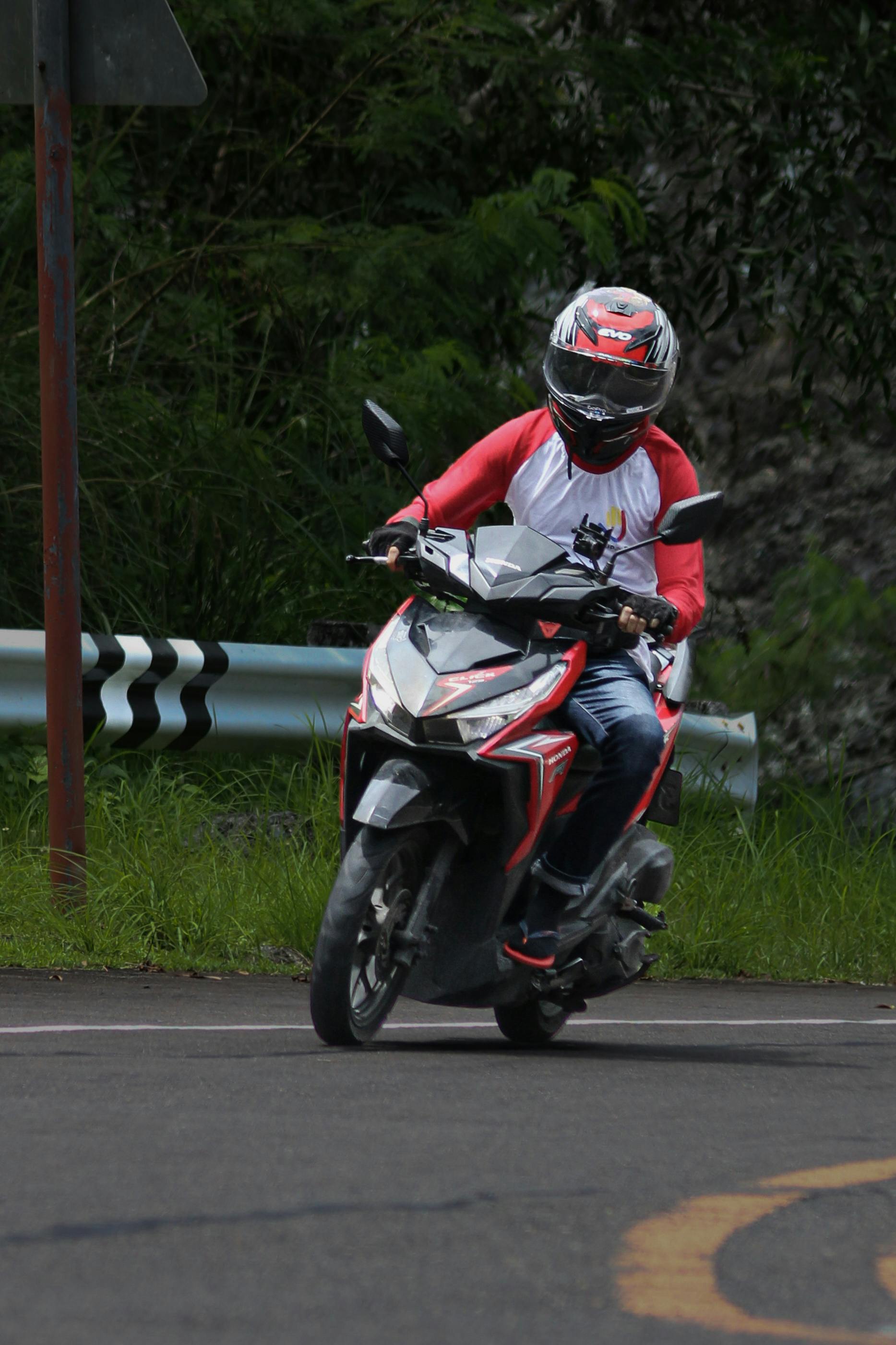 Woman Riding Motor Scooter Travelling on Asphalt Road during Sunrise ...