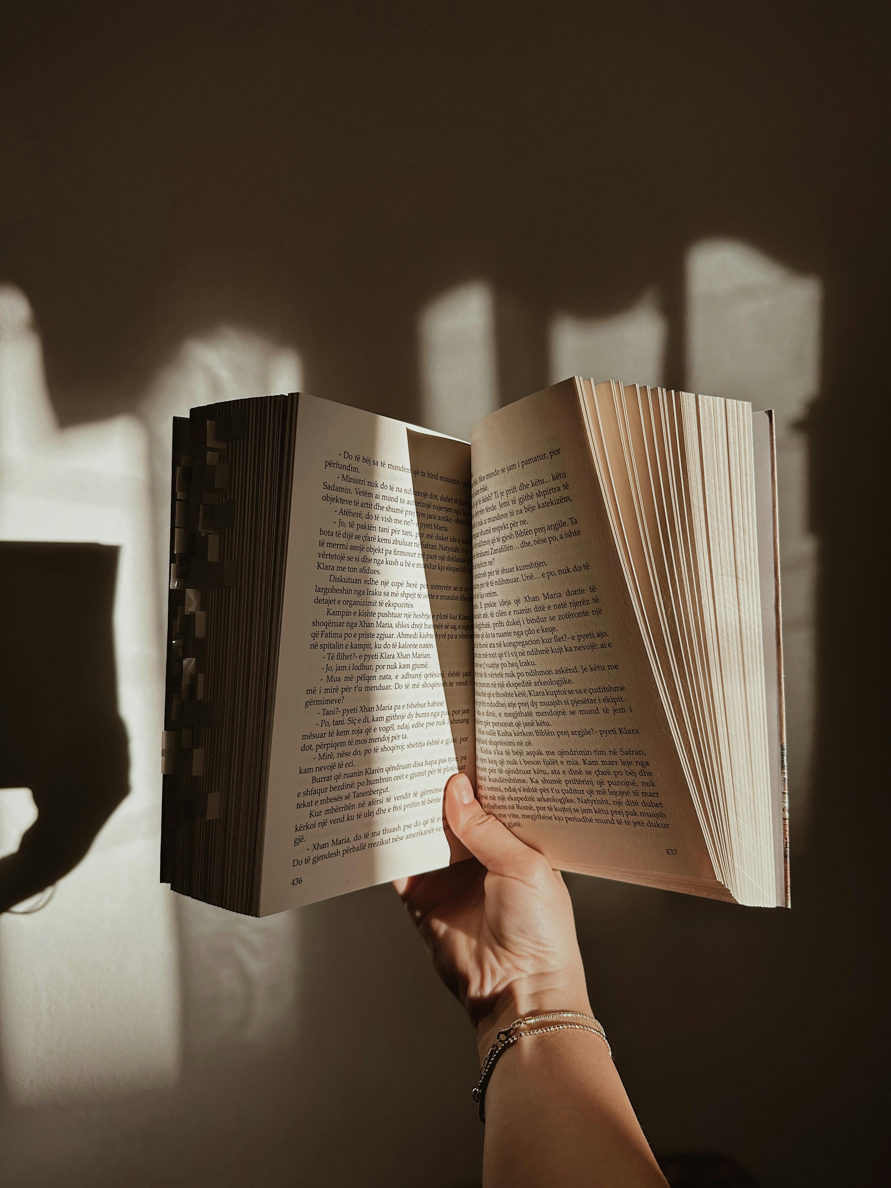 Person Holding Open Book · Free Stock Photo