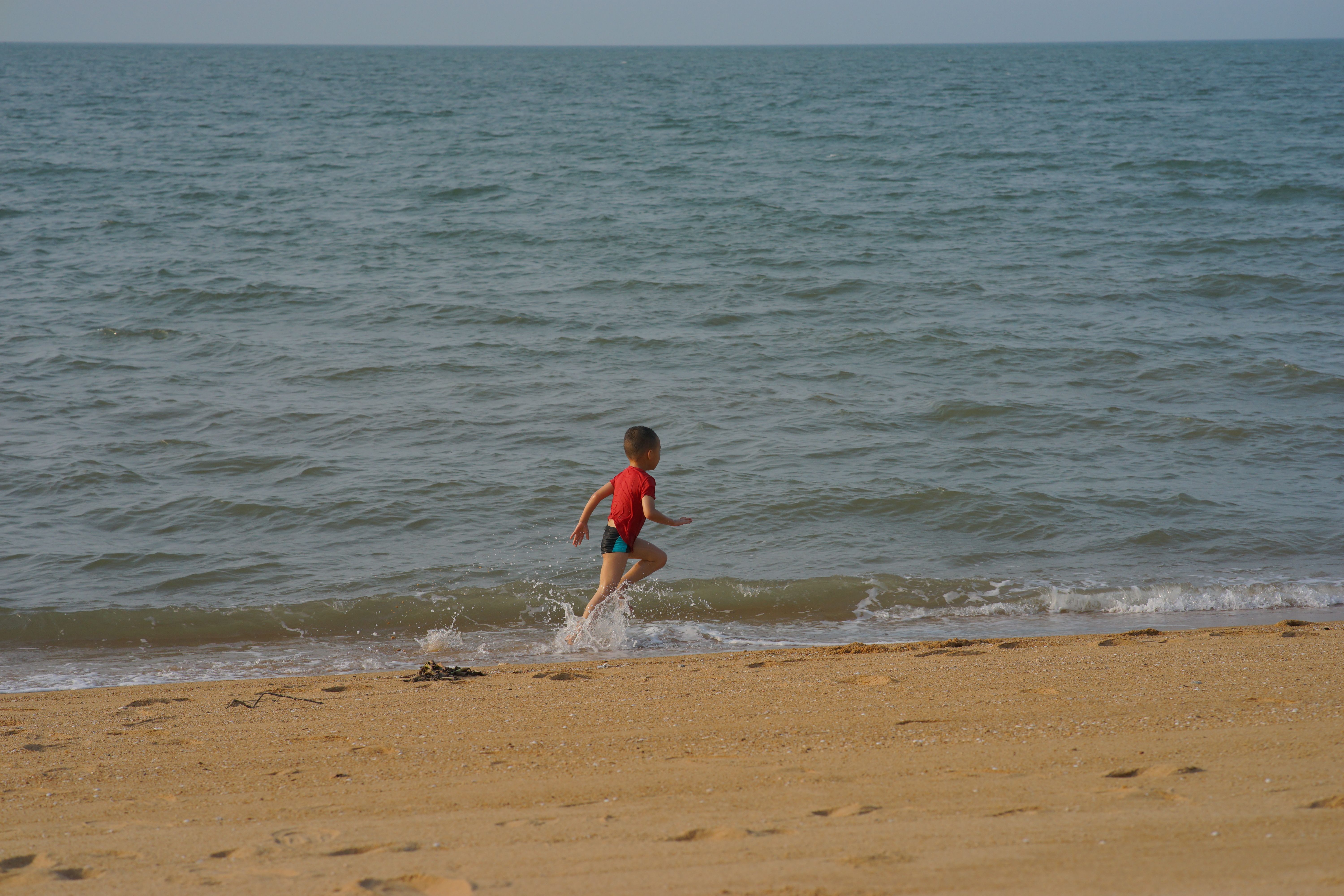 Boy Running on Beach on Sea Shore · Free Stock Photo