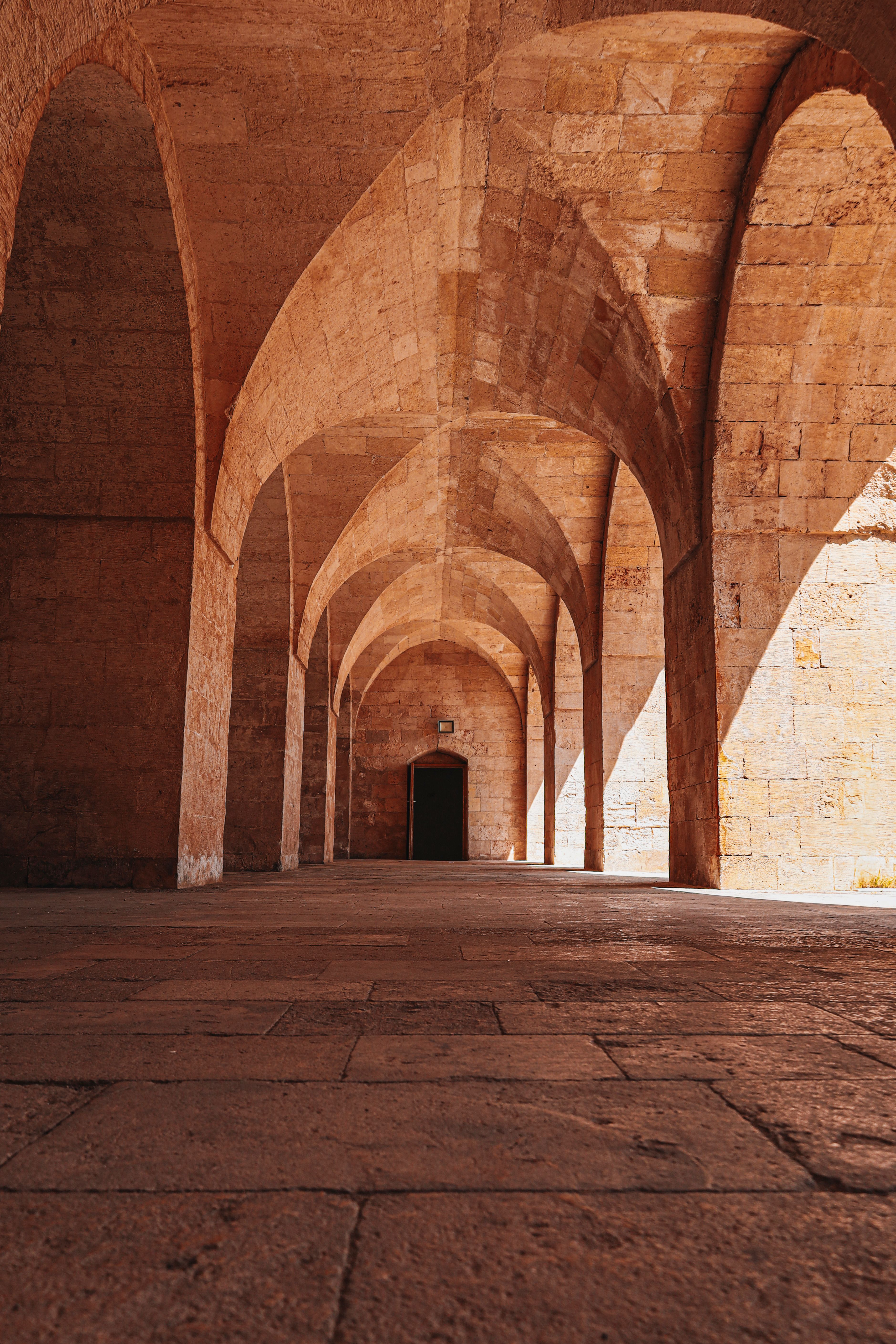 Arches and Walls of Stone Building · Free Stock Photo