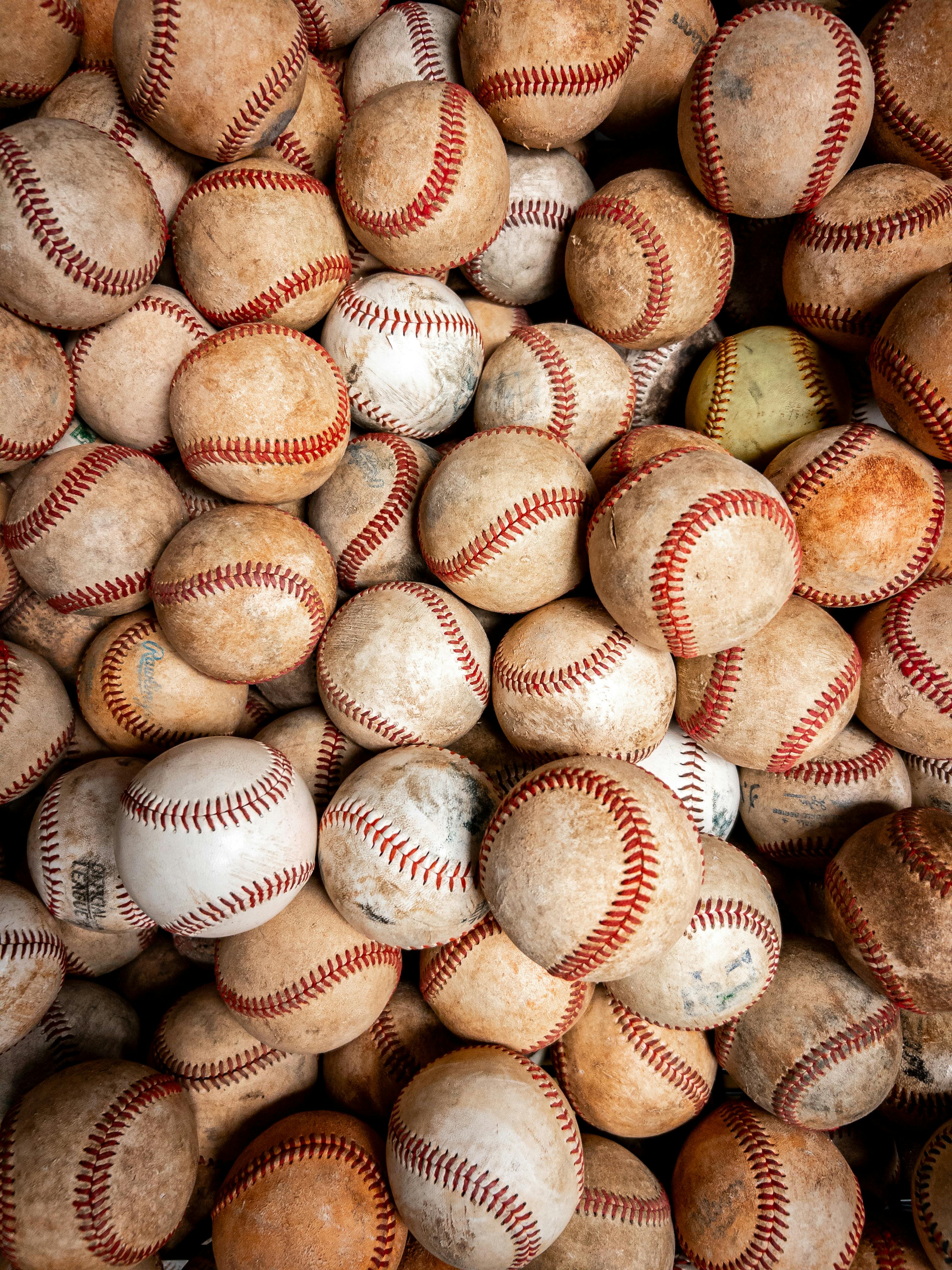 A pile of baseballs are shown in this photo · Free Stock Photo