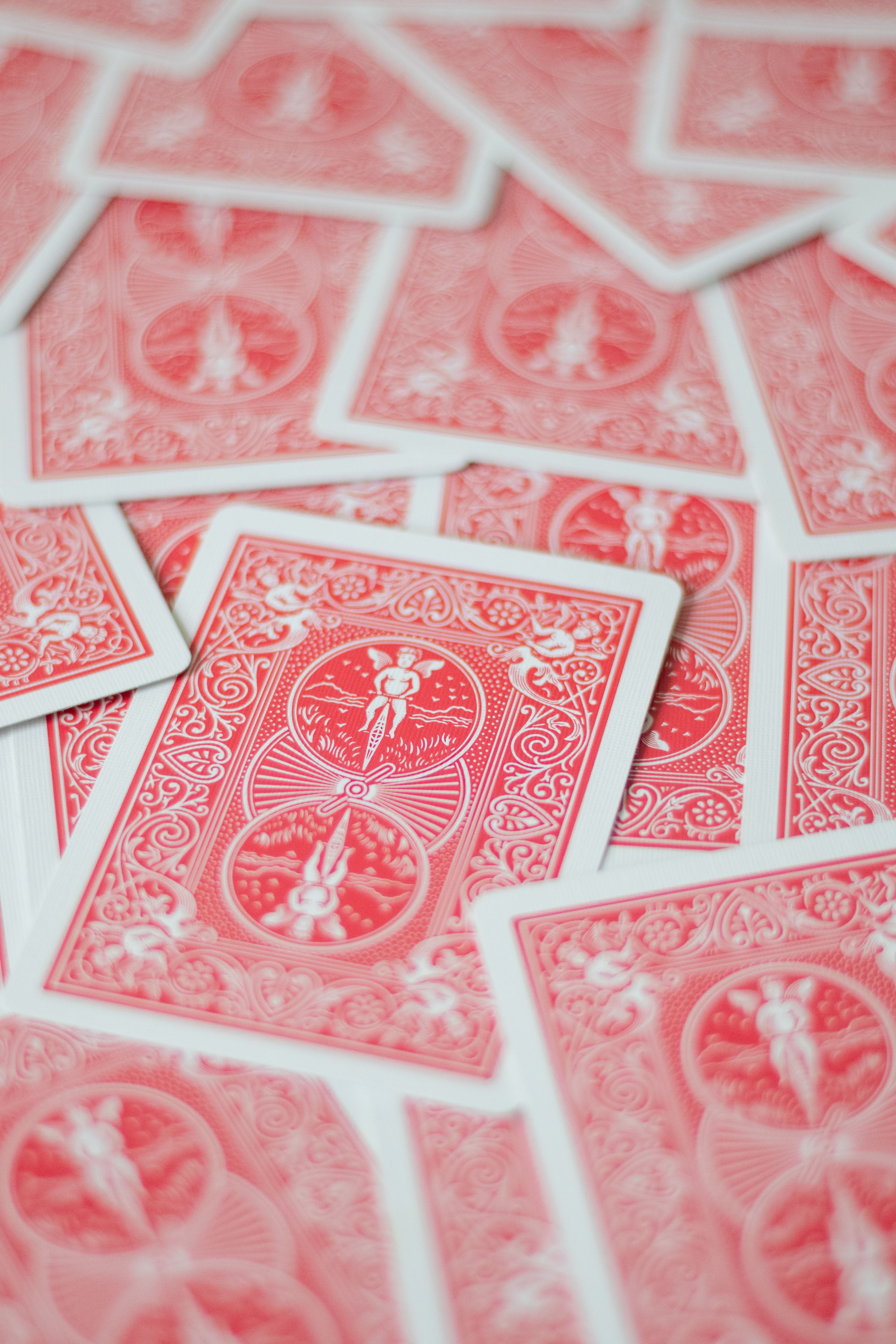 A pile of red playing cards with a red heart · Free Stock Photo