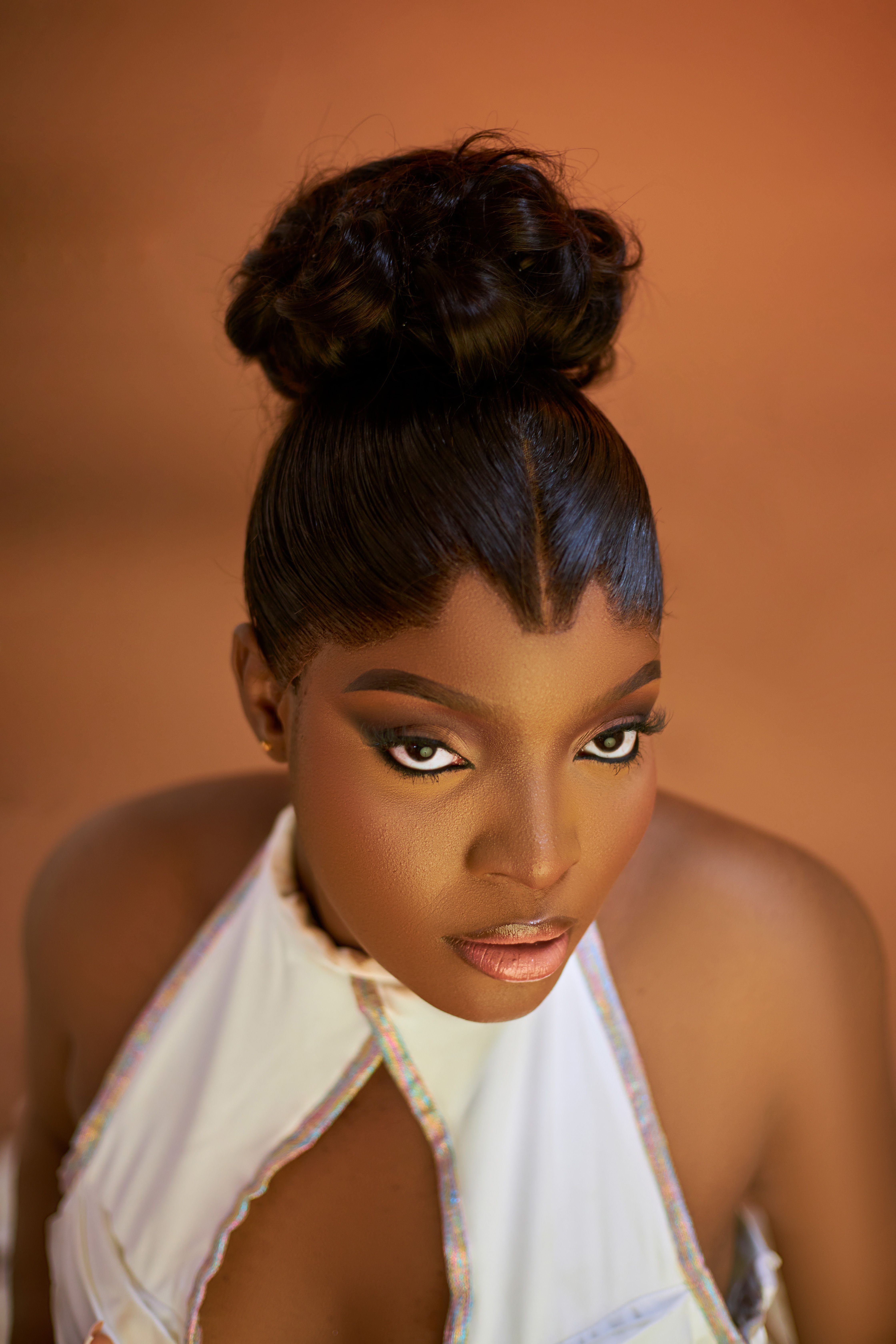 Studio Portrait of a Female Model Wearing a Hair Bun · Free Stock Photo