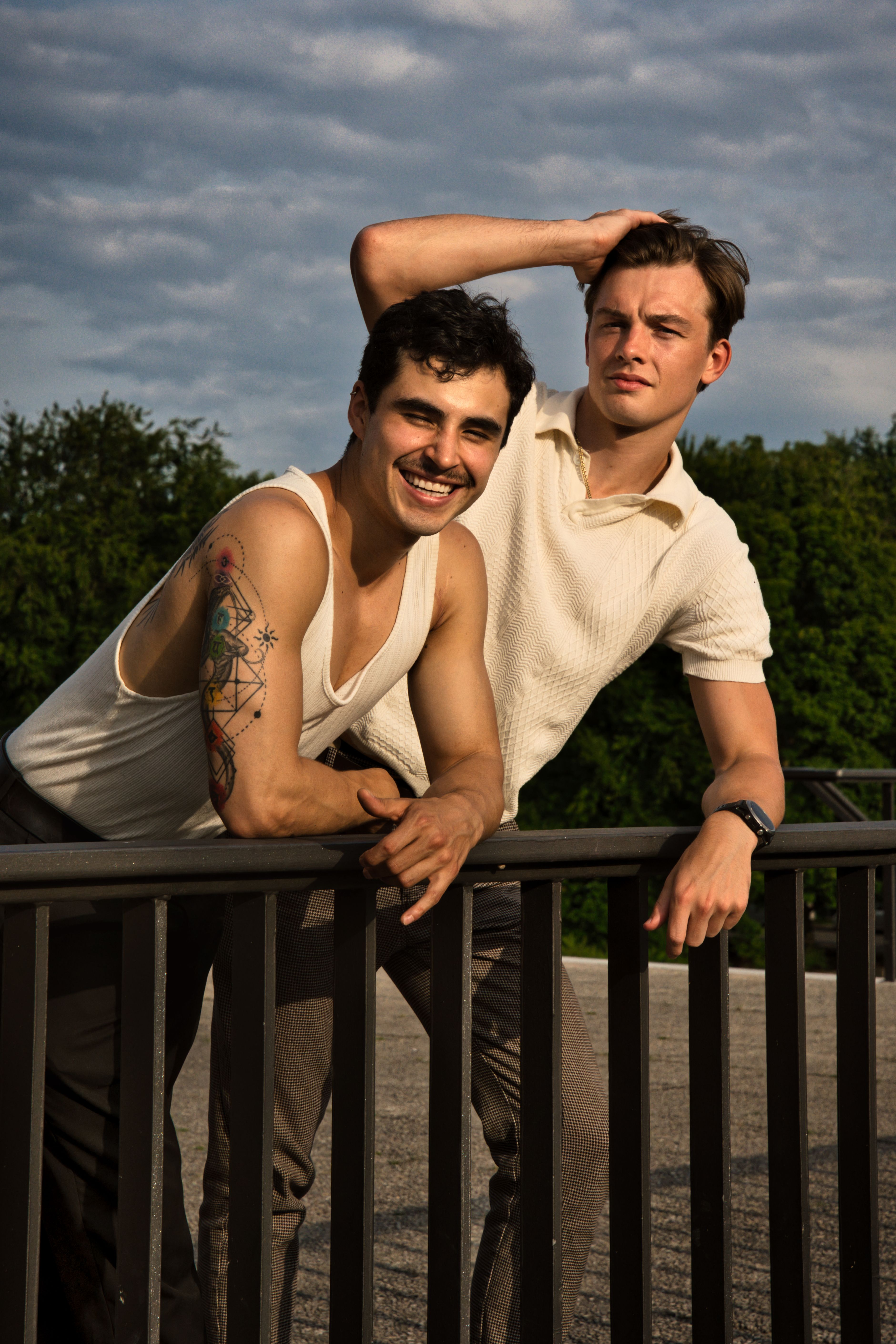 Two Men Posing on a Bridge · Free Stock Photo