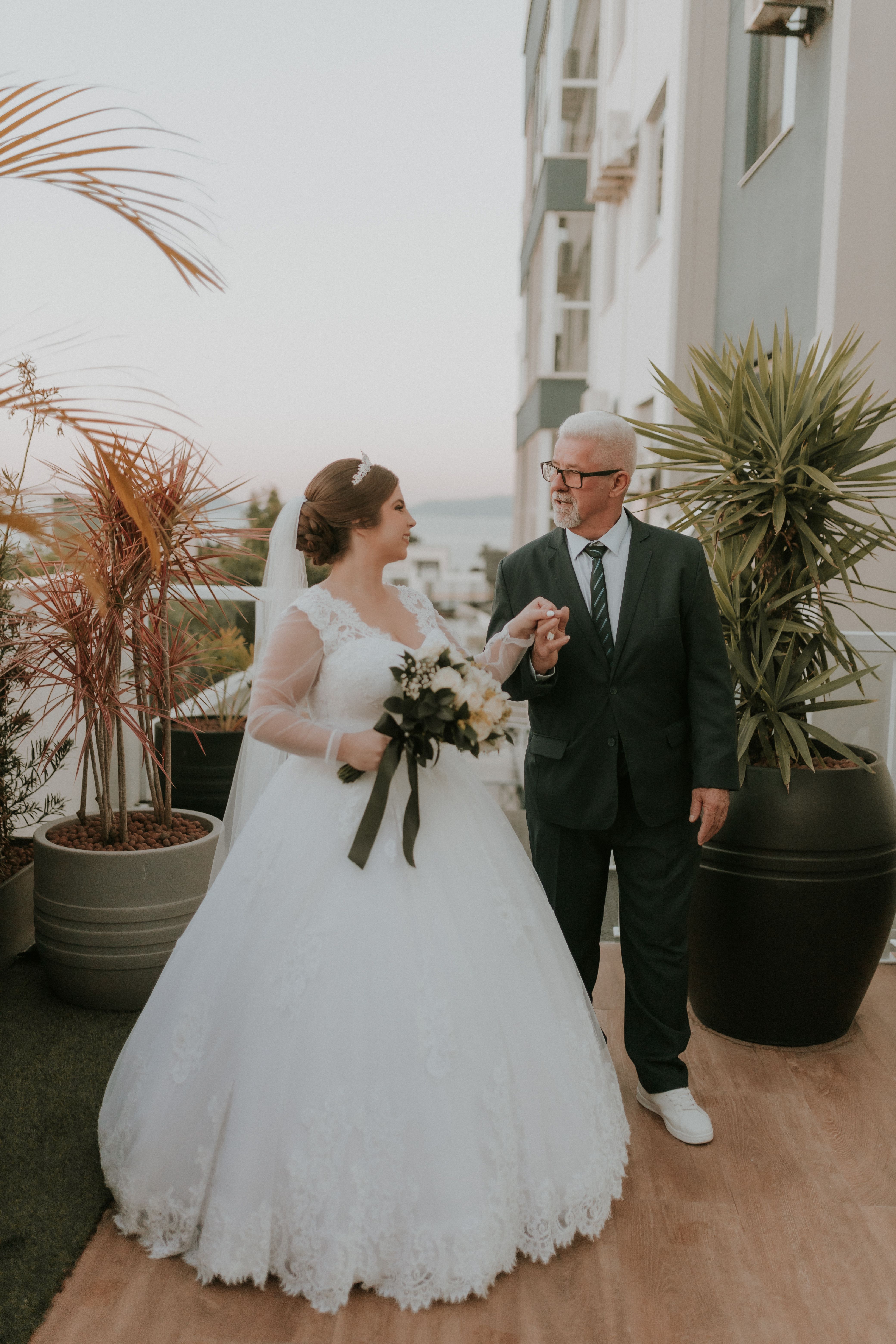 Bride and Father Standing and Holding Hands · Free Stock Photo