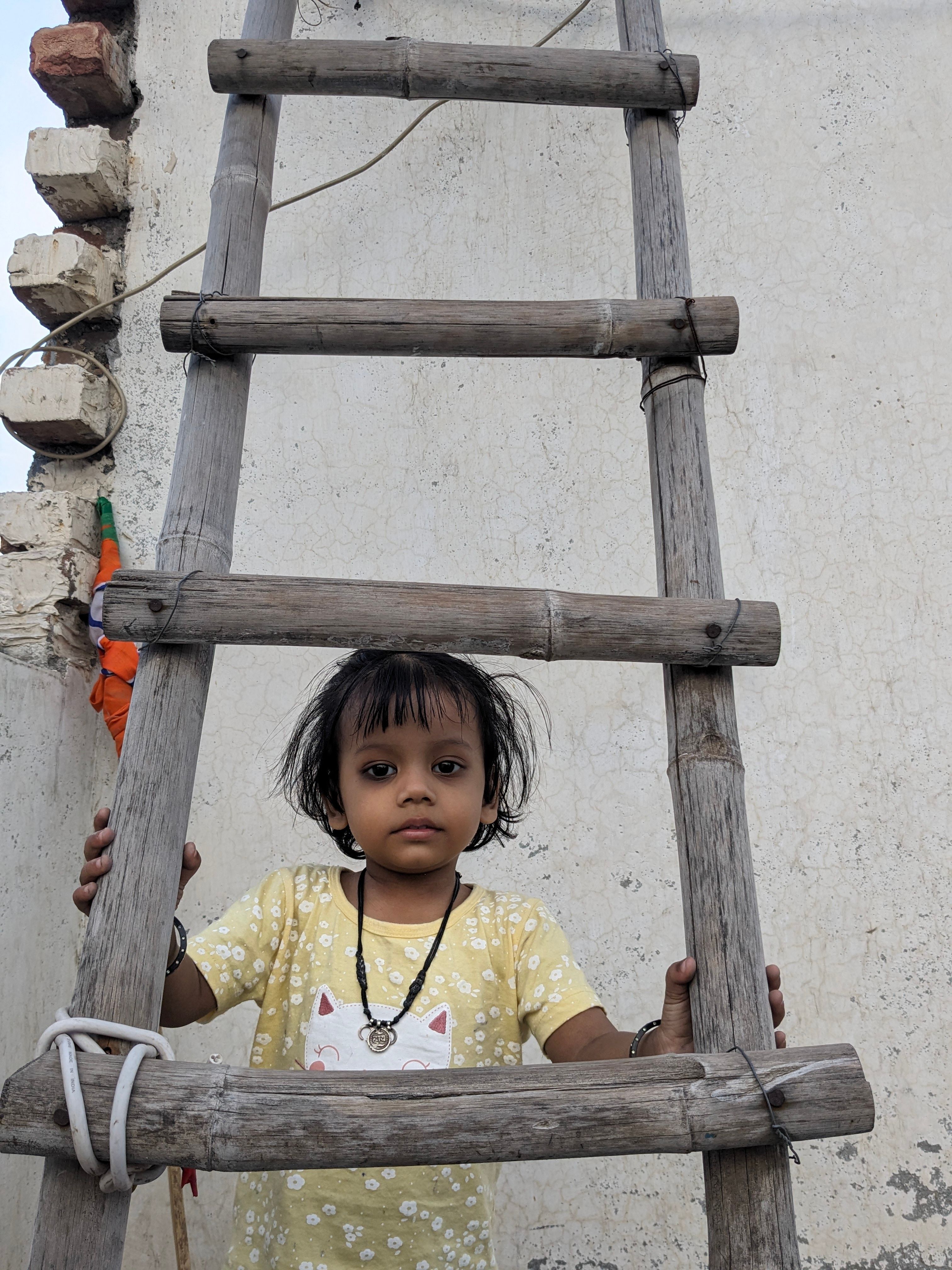 Girl Behind a Wooden Ladder · Free Stock Photo