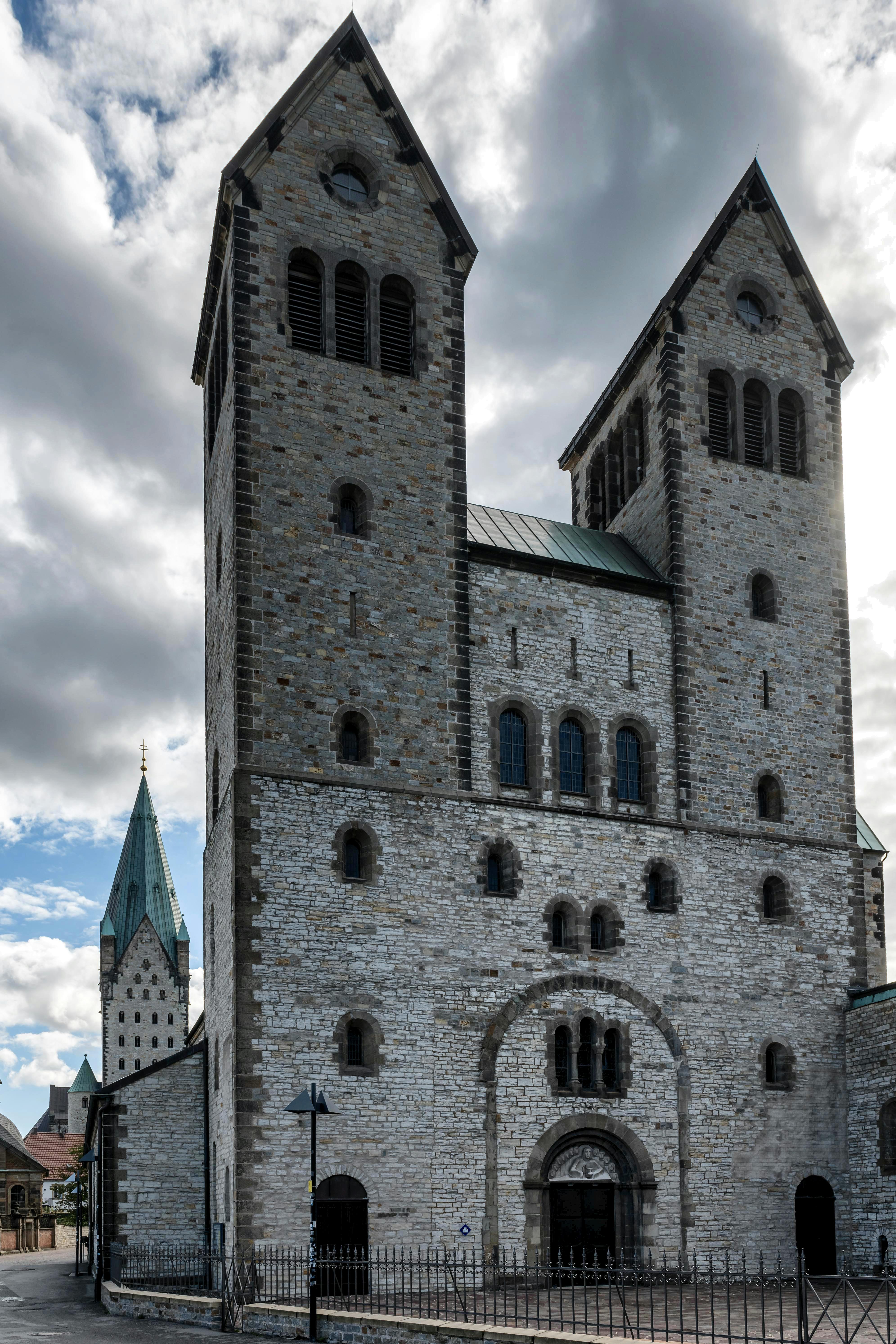 Facade of Small Stone Church with Two Towers · Free Stock Photo
