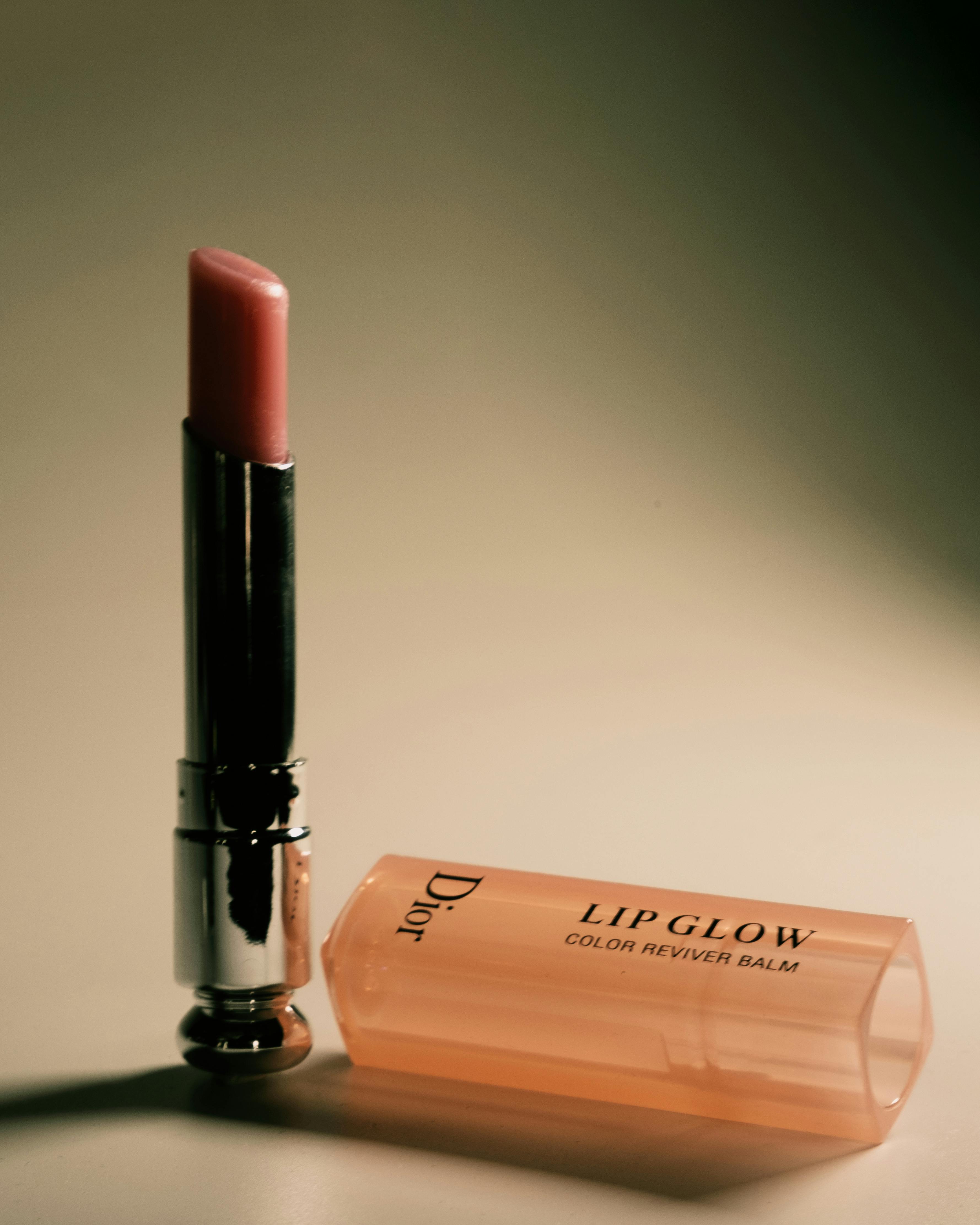 Dior lipstick in pink with a tube of lipstick · Free Stock Photo