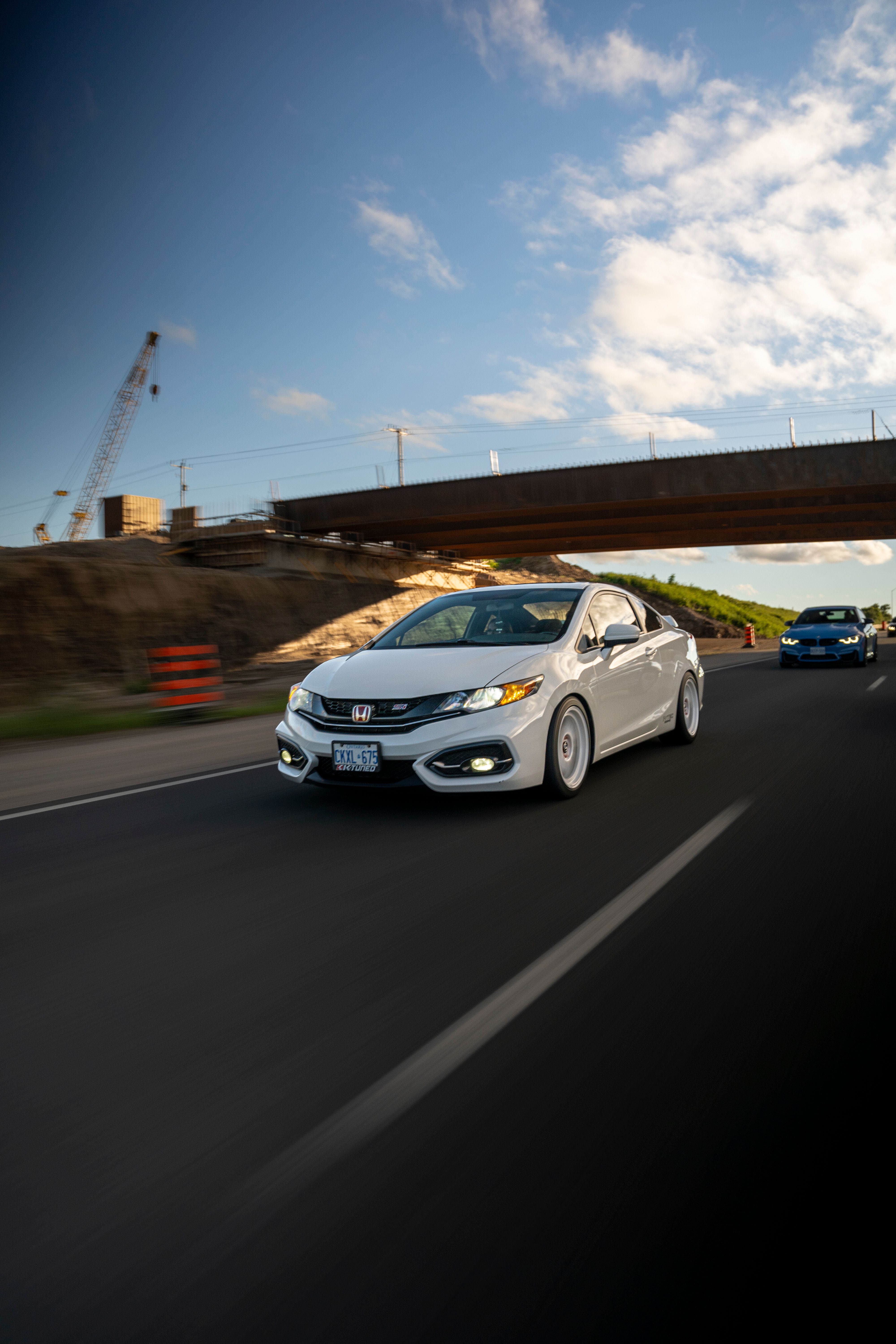 A White Honda Civic Si Driving on the Street · Free Stock Photo