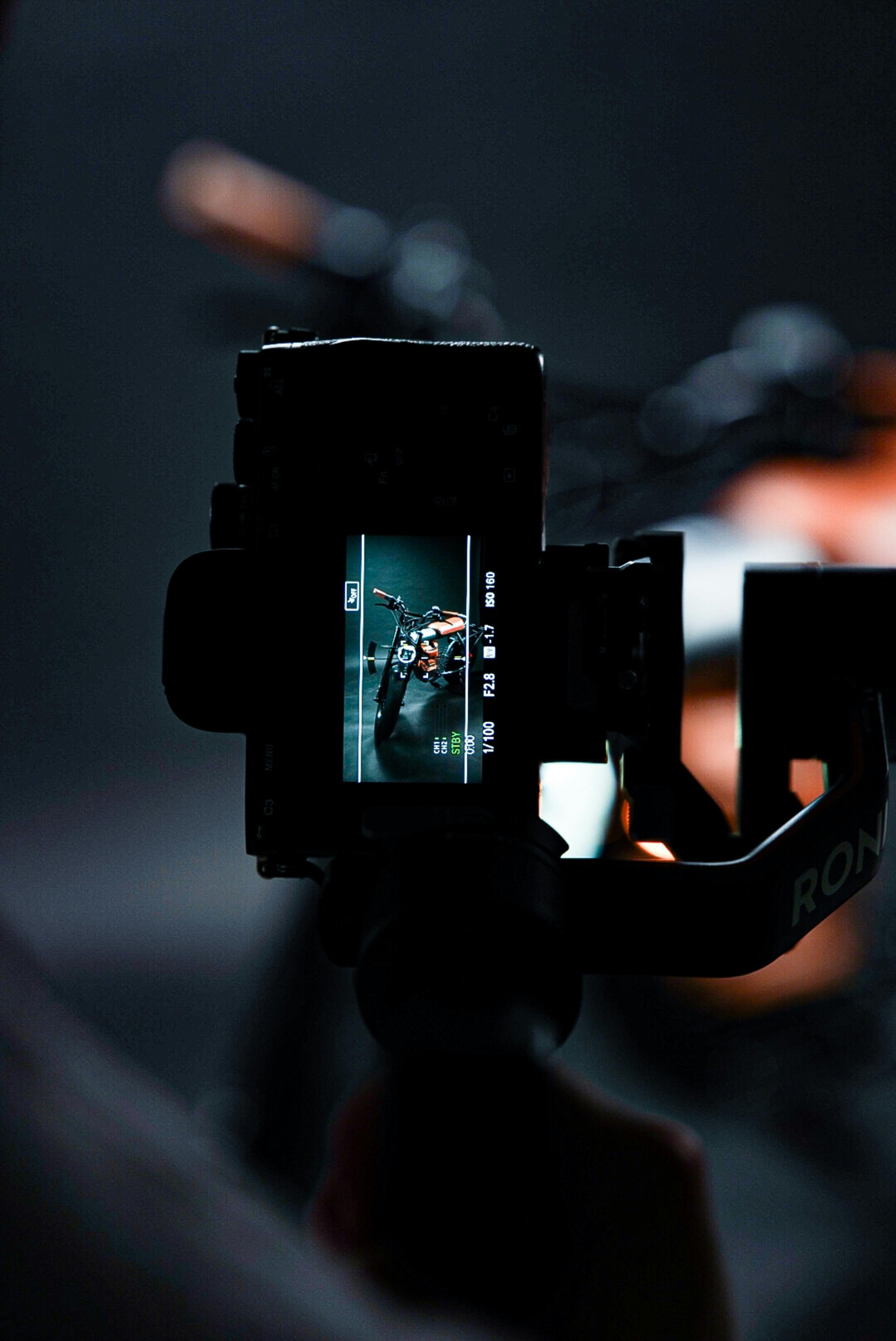 Close-up of a Camera Filming a Motorcycle · Free Stock Photo