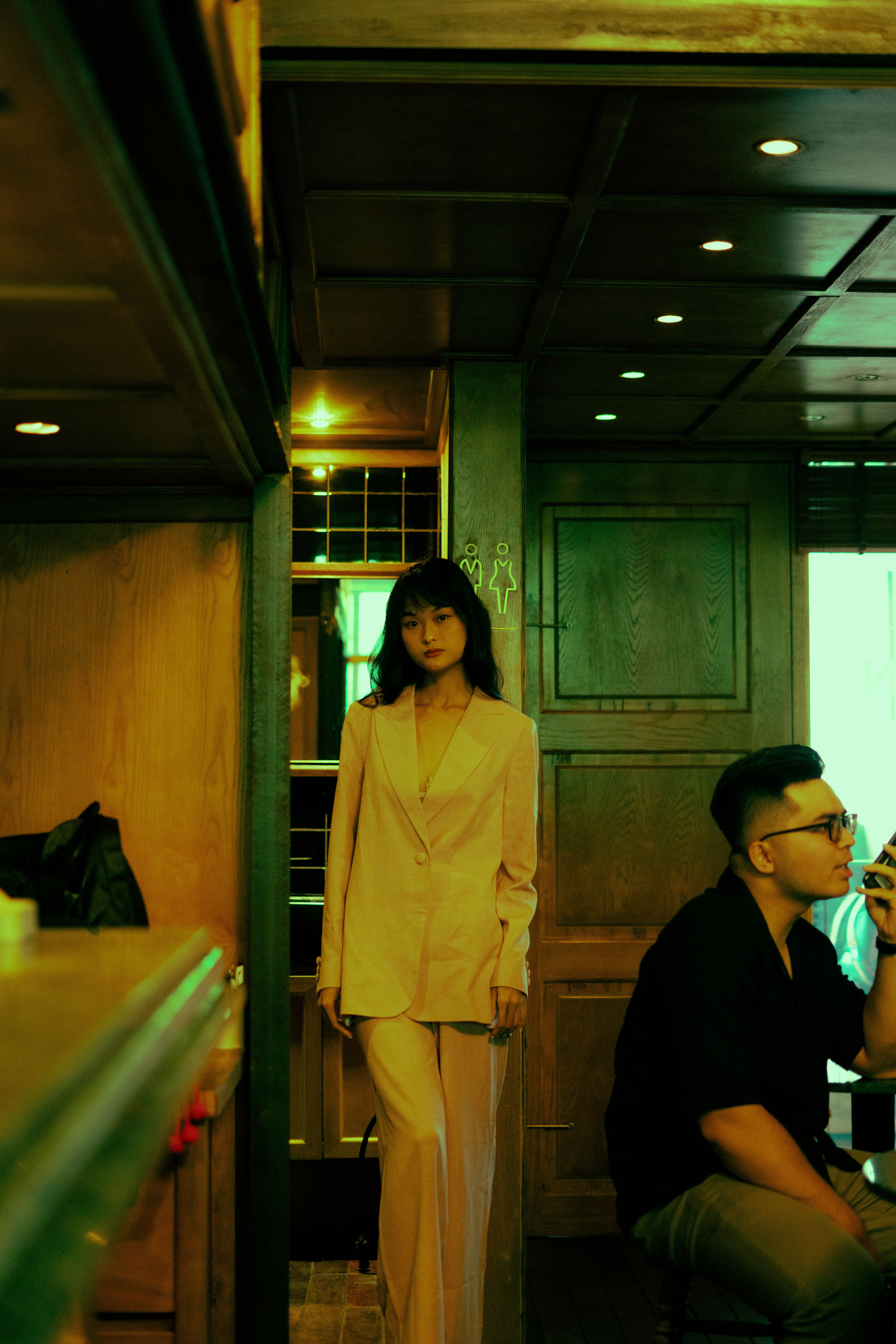 Woman in Suit Jacket Walking at Bar · Free Stock Photo