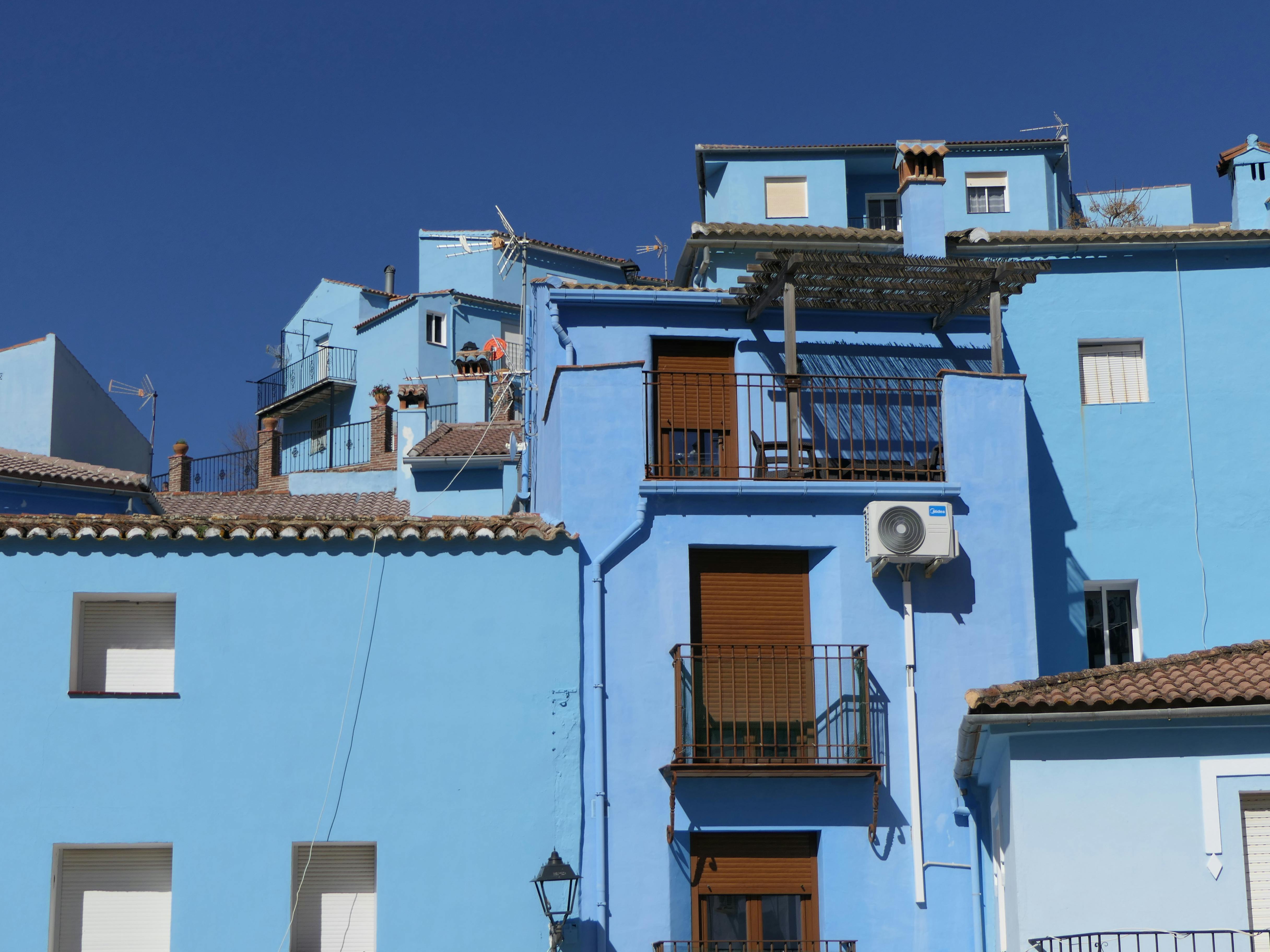 Facade of a Blue Apartment Building in a City · Free Stock Photo