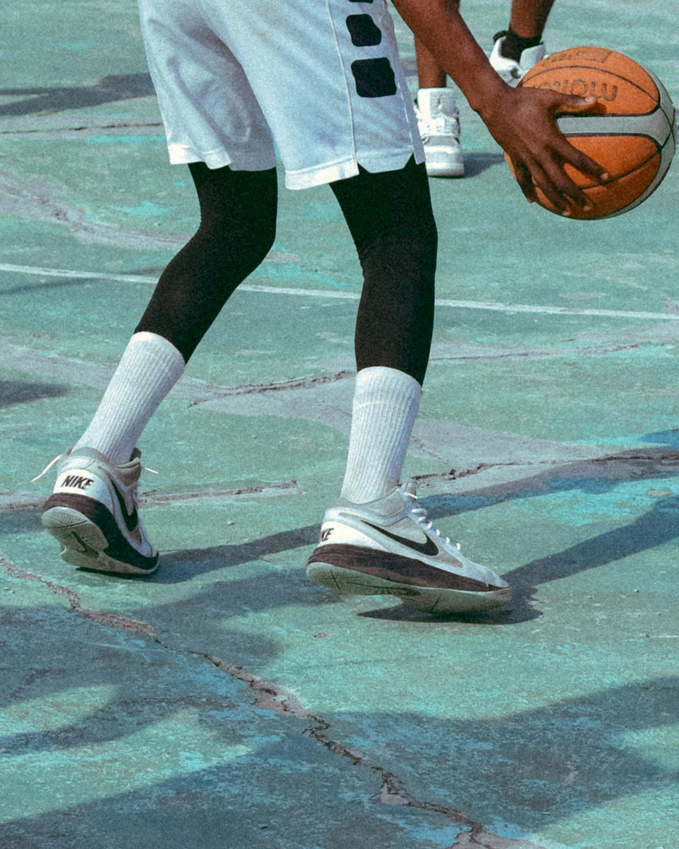 Woman Lying on Basketball Free Throw Line · Free Stock Photo