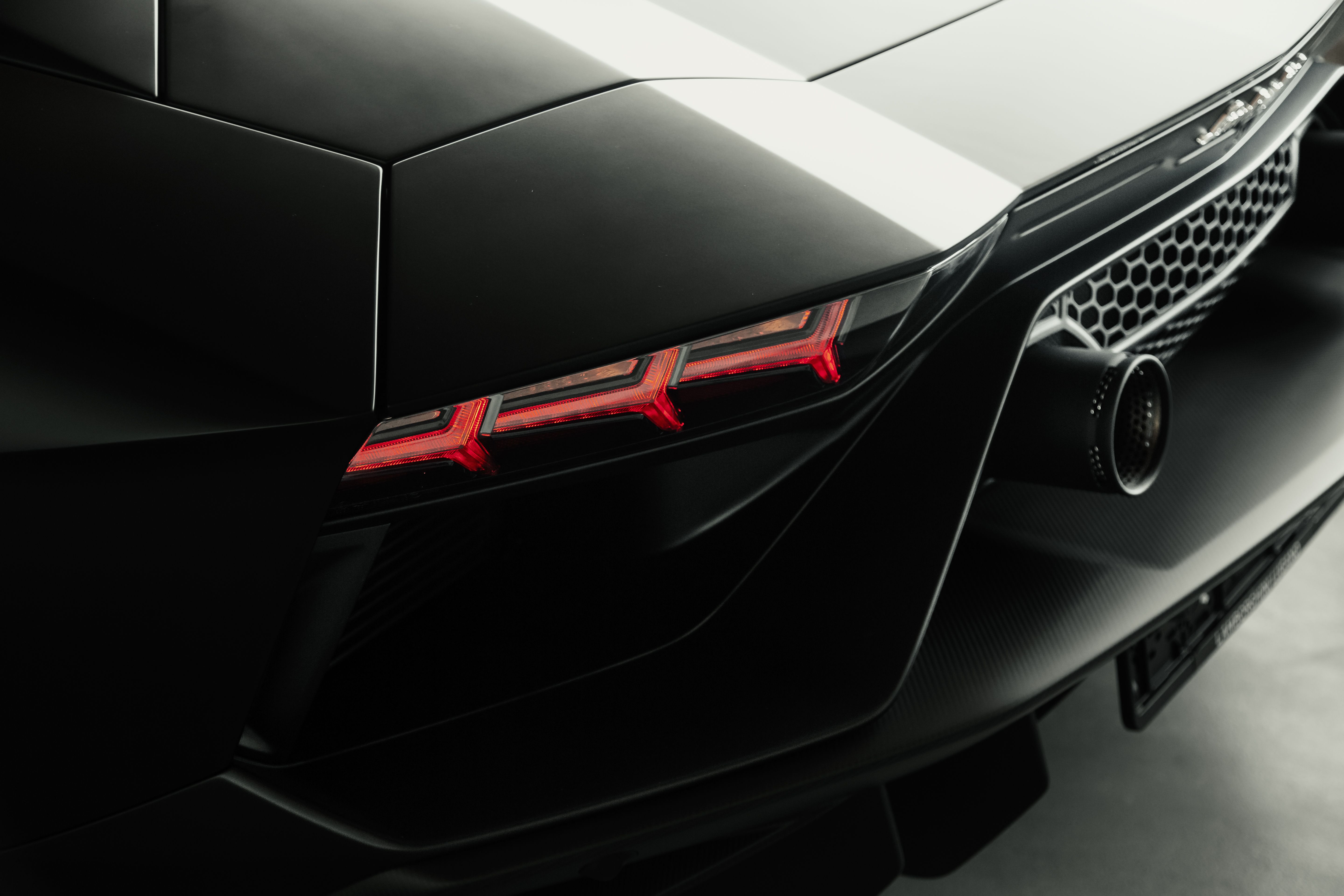 Back View of a Black Lamborghini · Free Stock Photo
