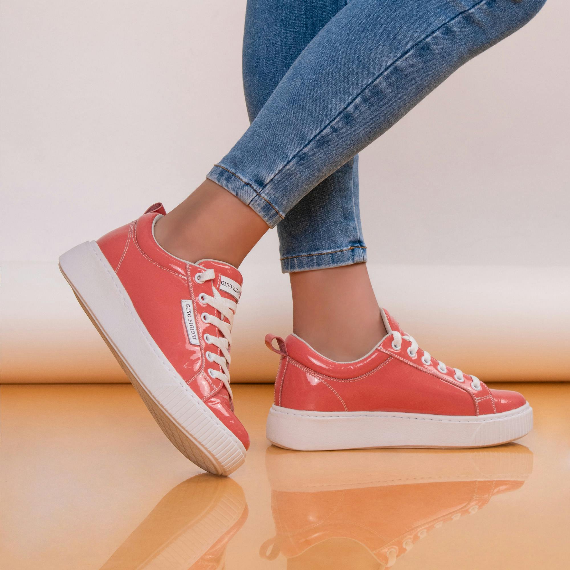 Red Leather Trainers on Feet · Free Stock Photo