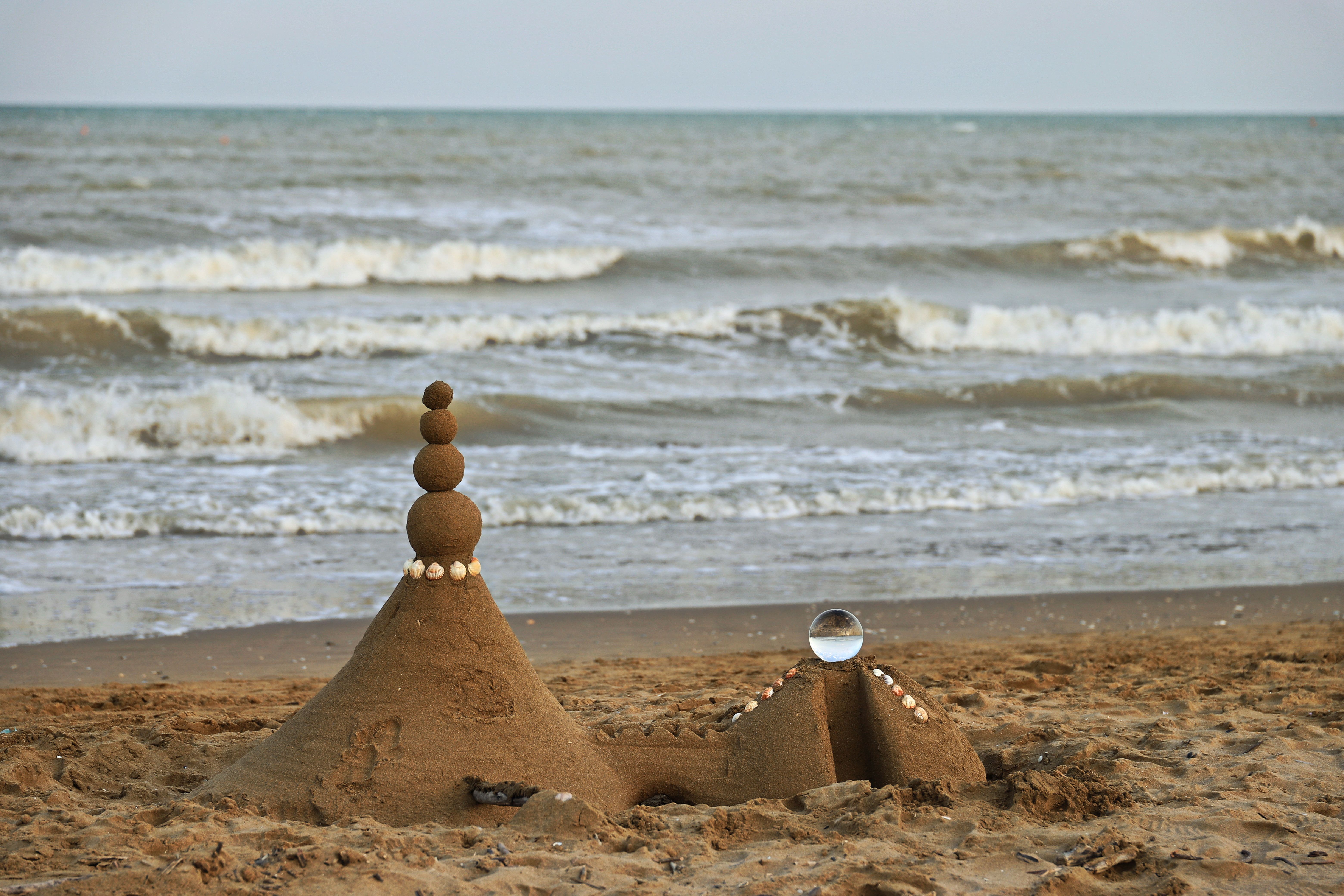 Glass Ball on a Sand Castle · Free Stock Photo