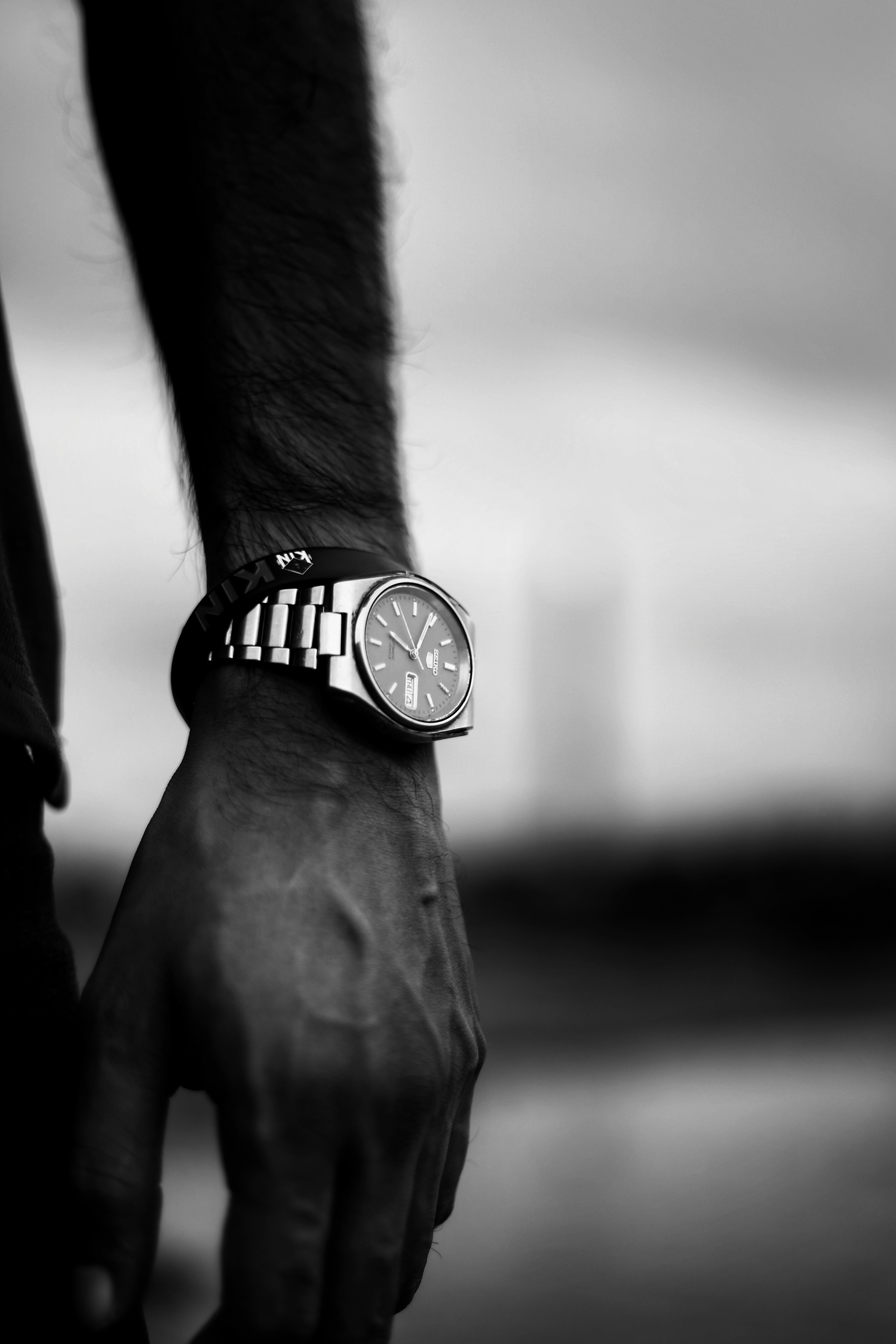 Close-up of Hand with a Watch and Rubber Wristbands · Free Stock Photo