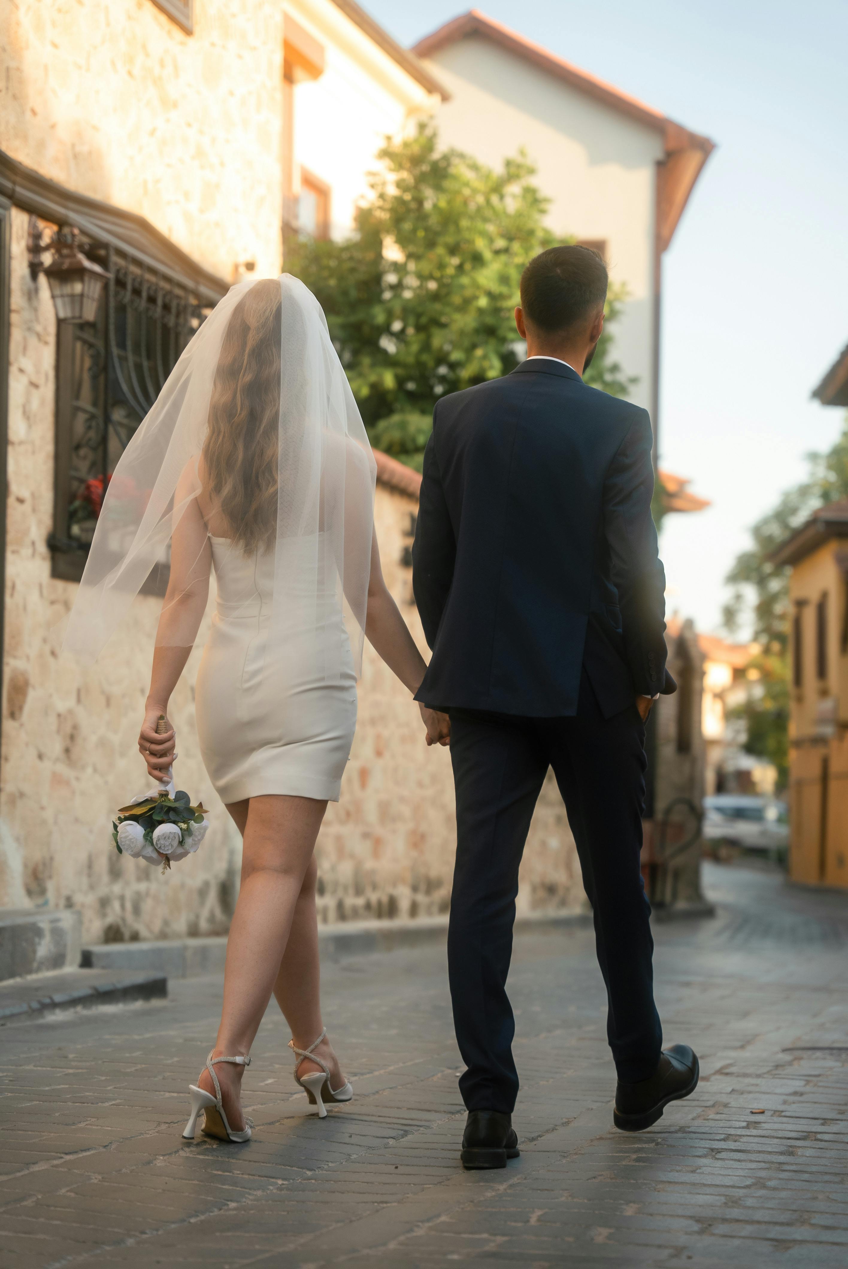 Newlyweds Walking Street and Holding Hands · Free Stock Photo