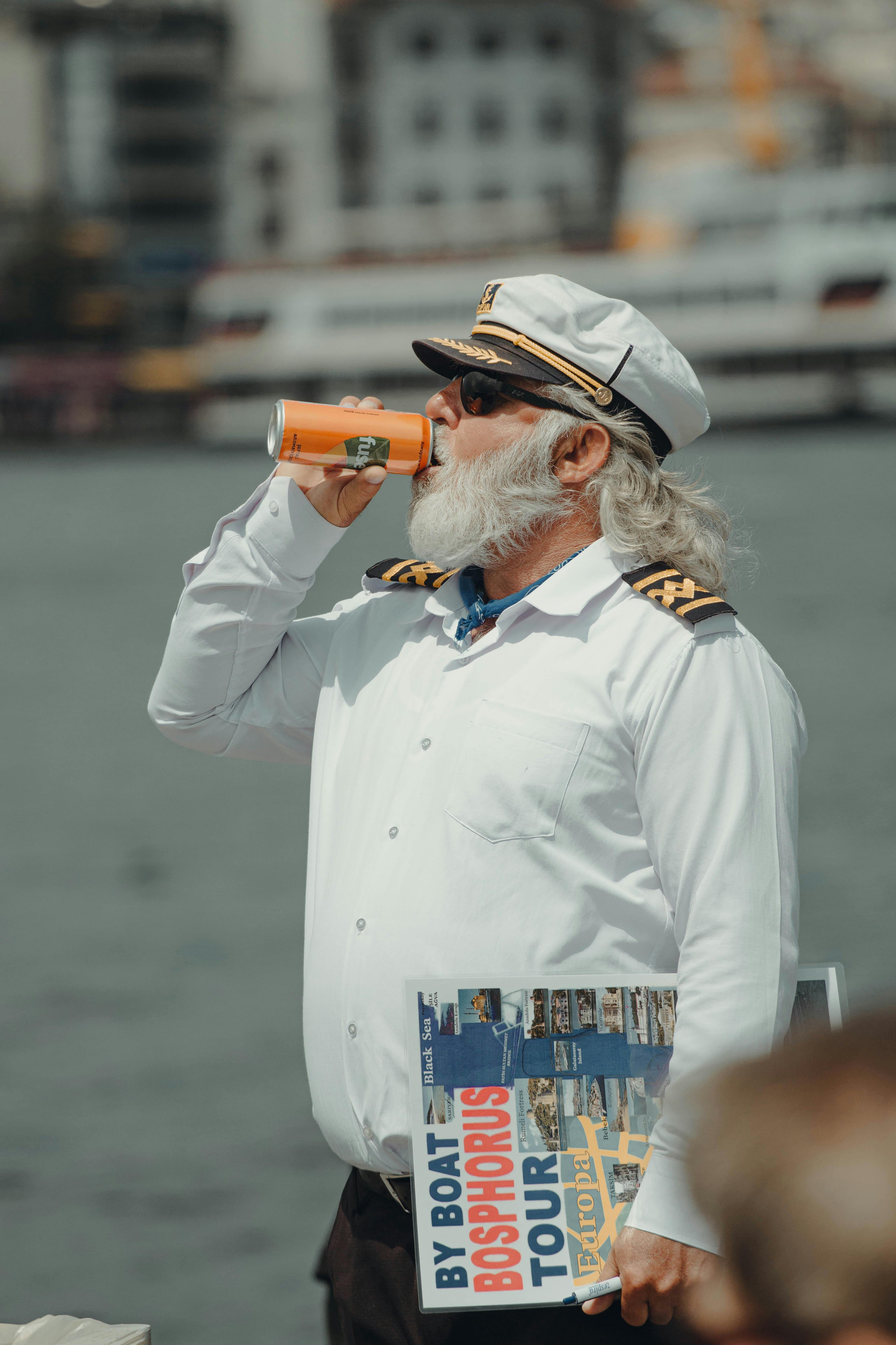 Captain Drinking Soda · Free Stock Photo
