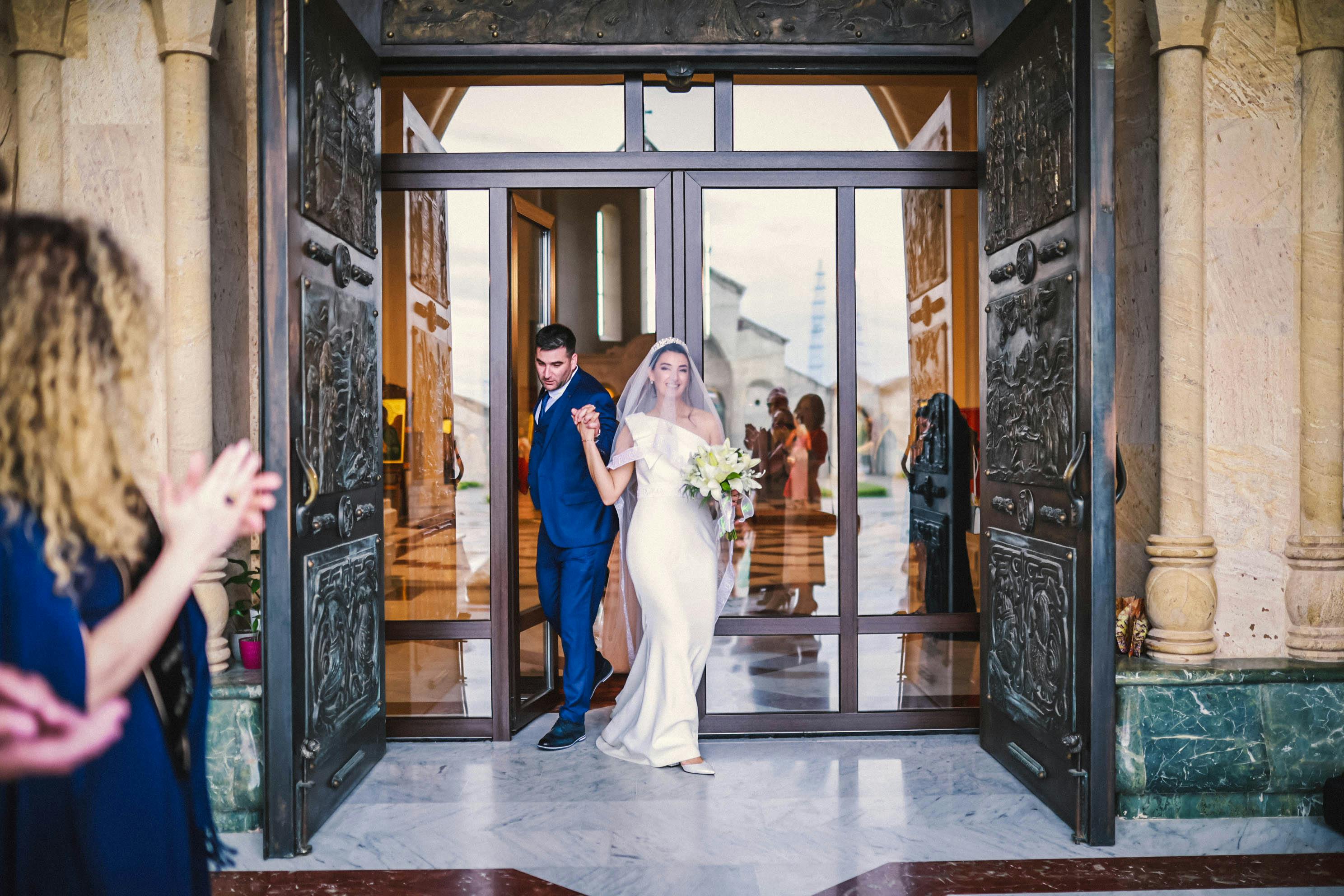 The Bride and Groom Walking Out of the Church · Free Stock Photo