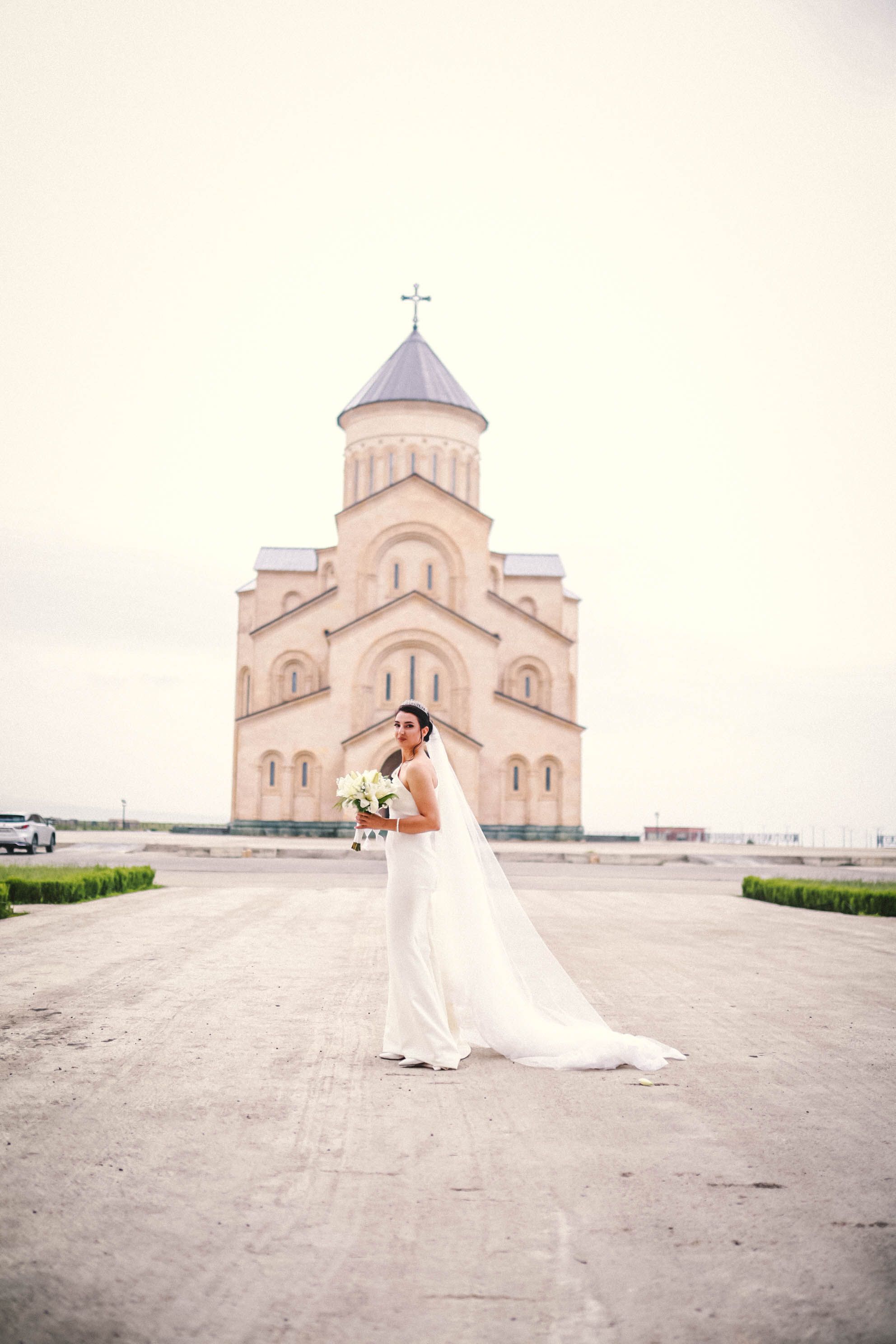 The Bride Standing in Front of the Church · Free Stock Photo