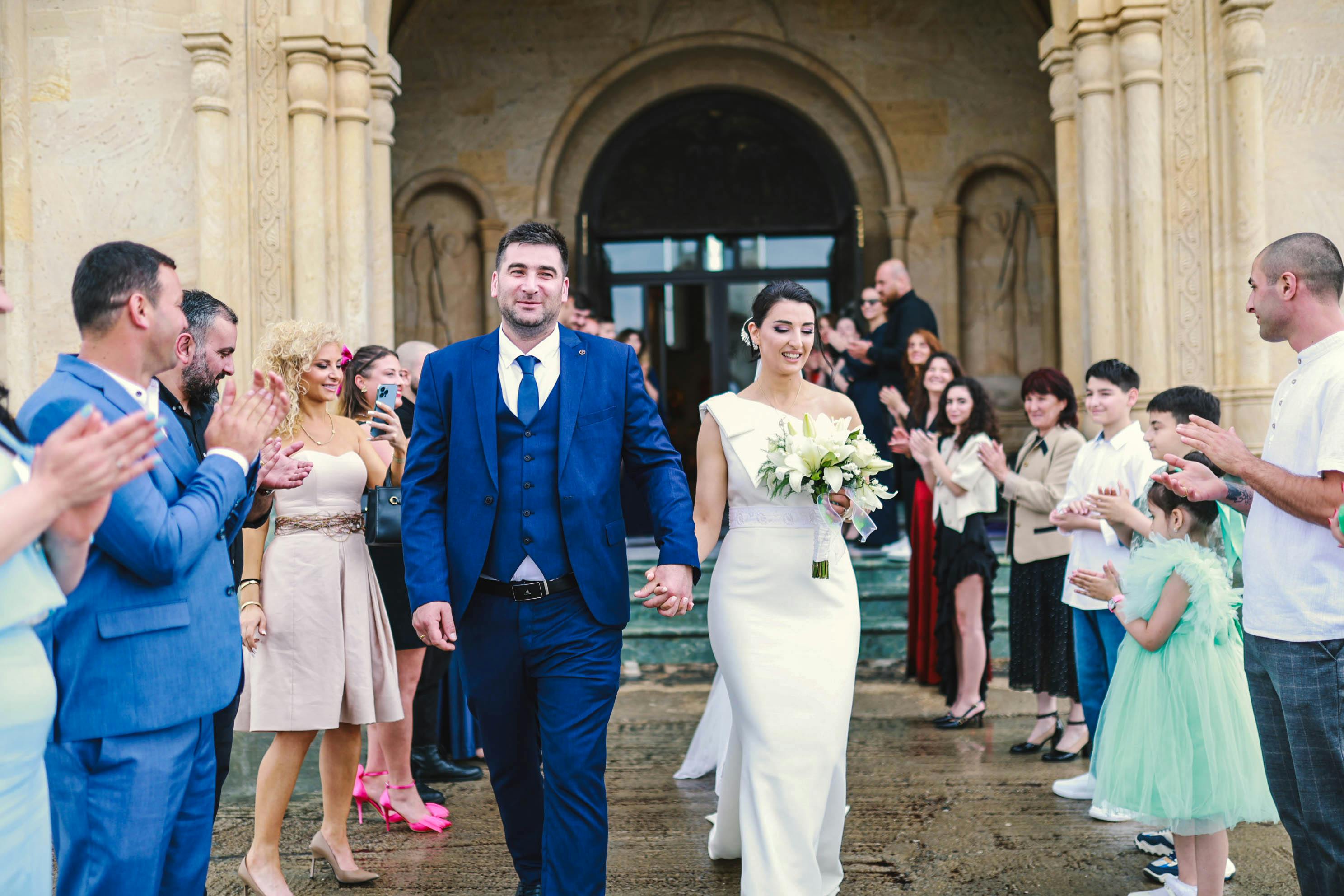 Holding Hands Newlyweds Walking between Lines of Guests after Wedding ...