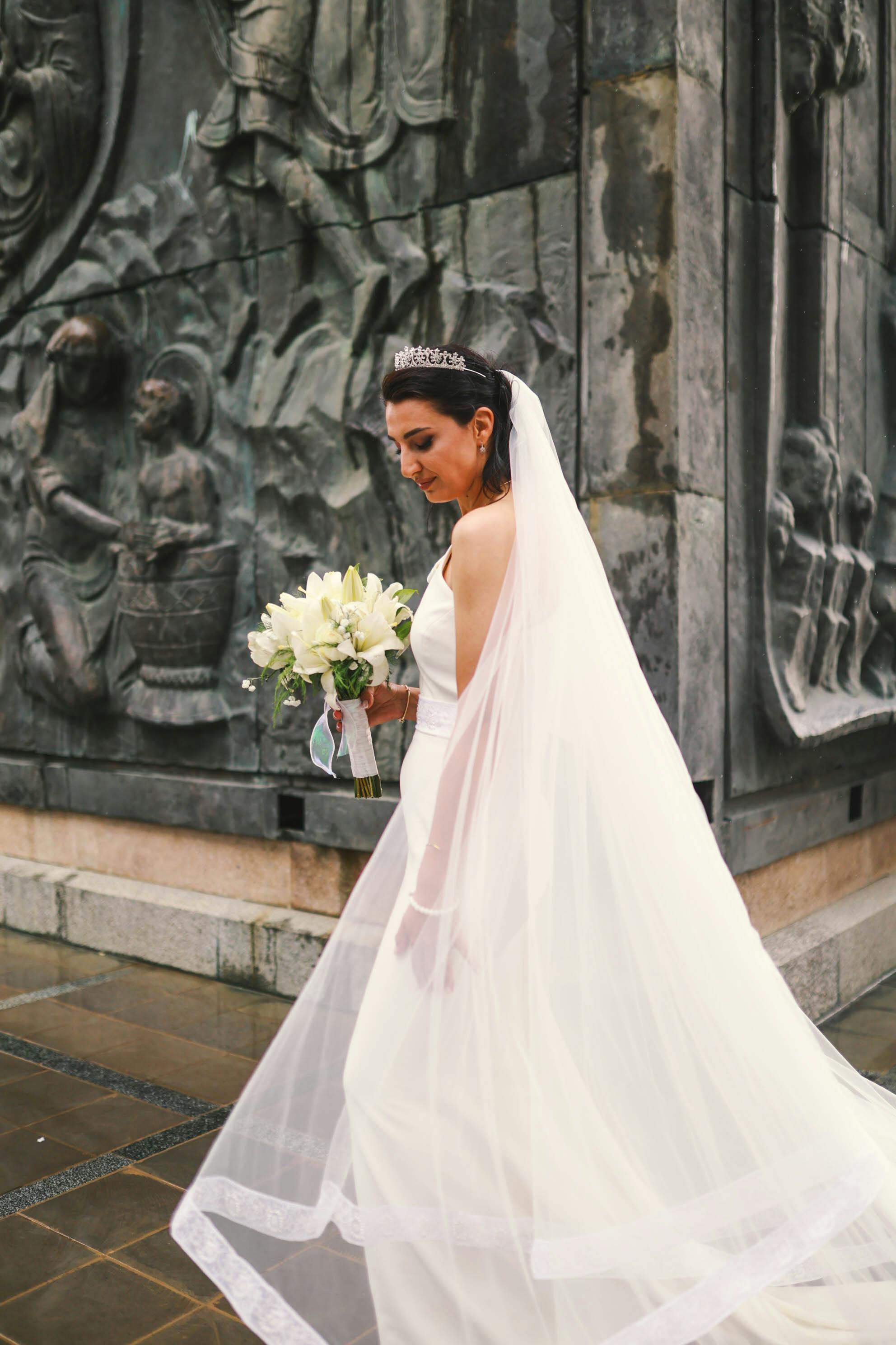 A Bride Walking by the Building · Free Stock Photo