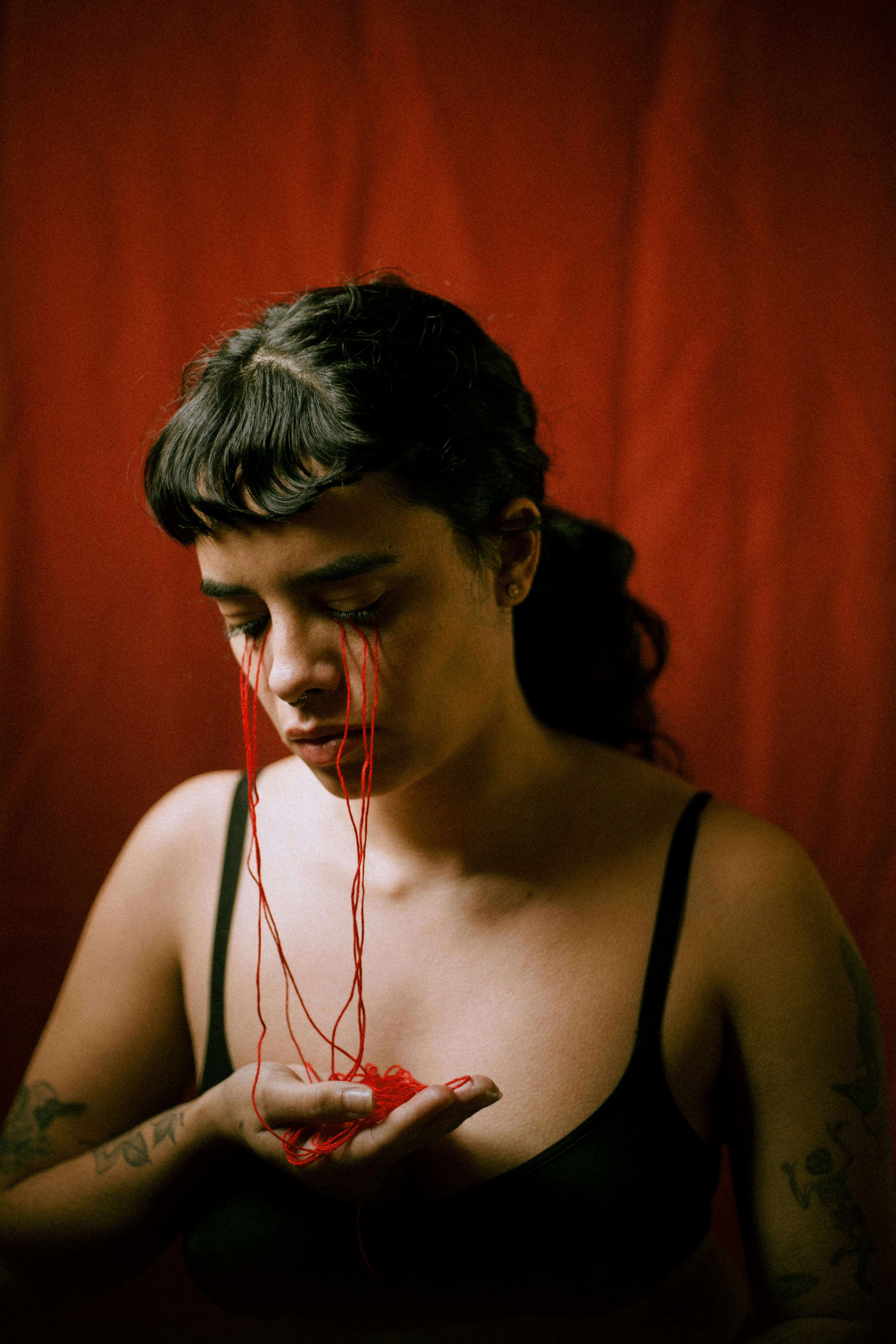 Red Thread Piercing under Woman Eyes · Free Stock Photo