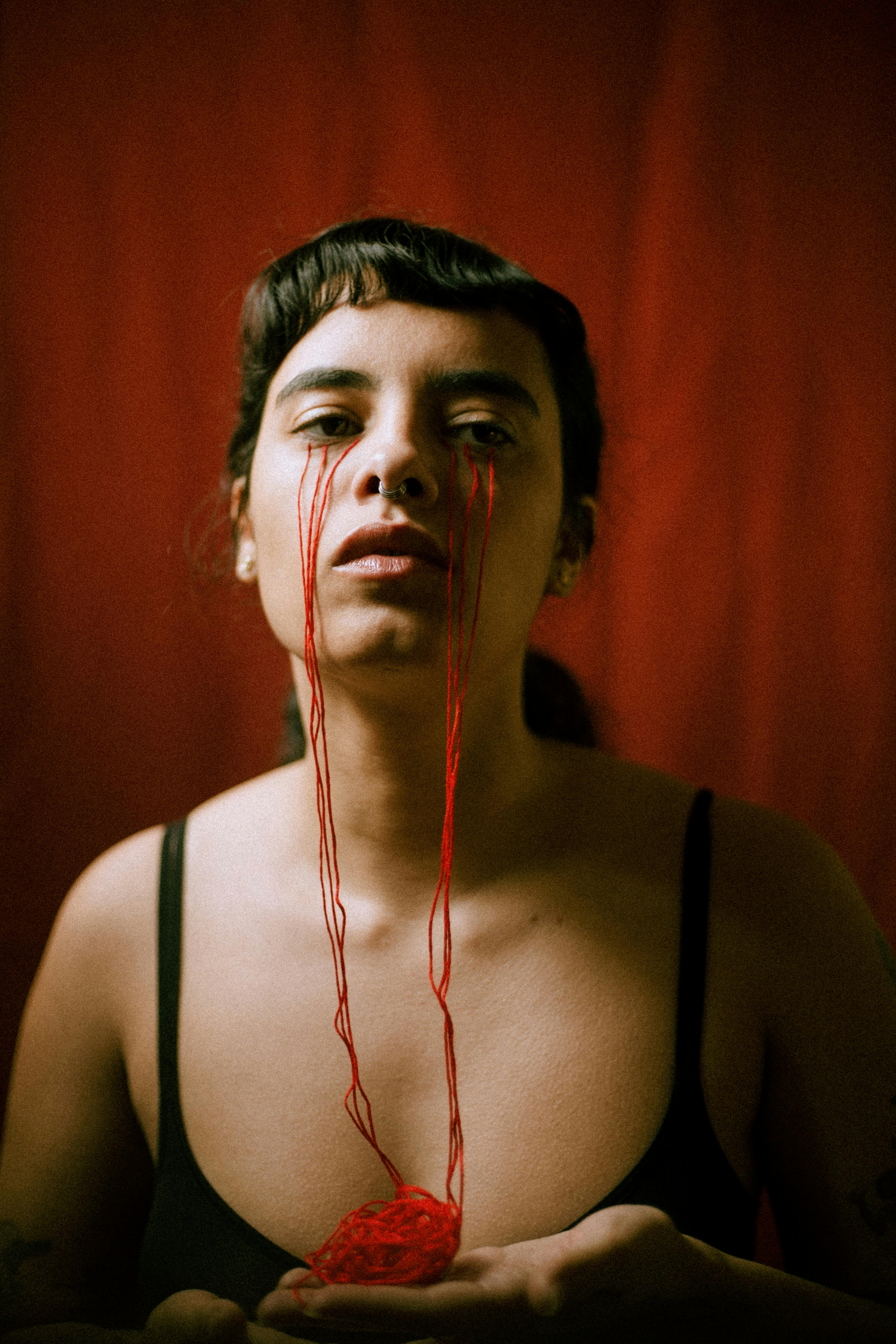 Red Thread Piercing under Woman Eyes · Free Stock Photo