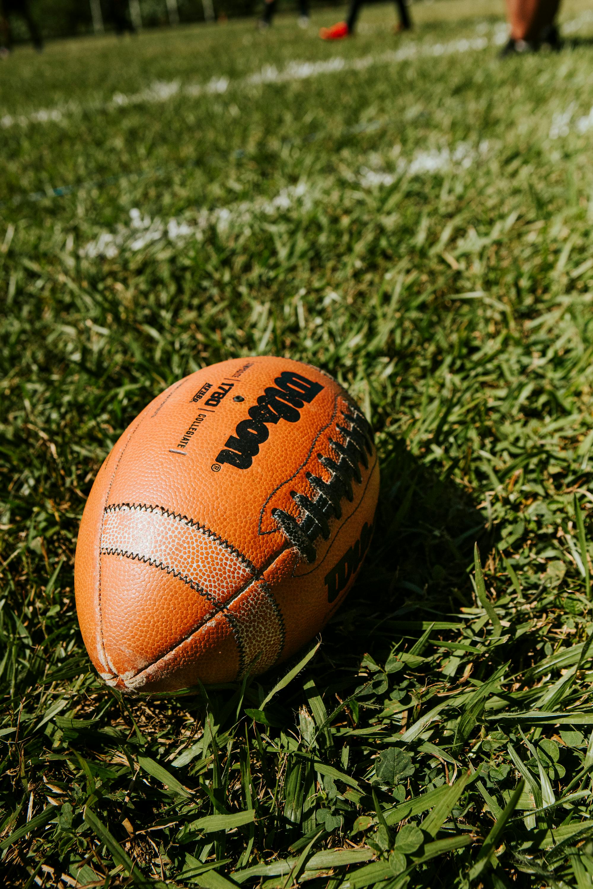 An Oval Football on Grass · Free Stock Photo