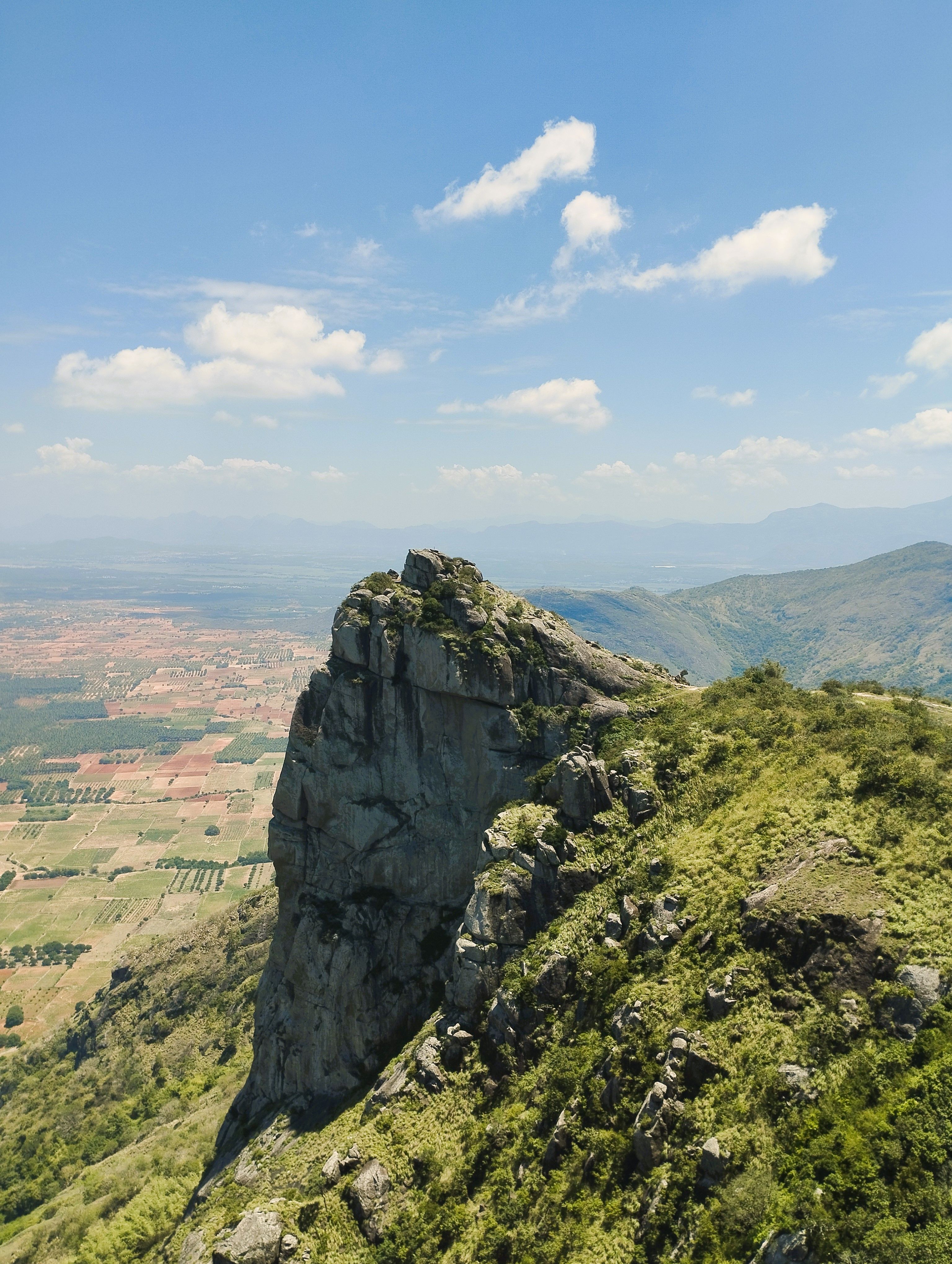 Rock Formation on Top of a Mountain and a Rural Fields in the Distance ...