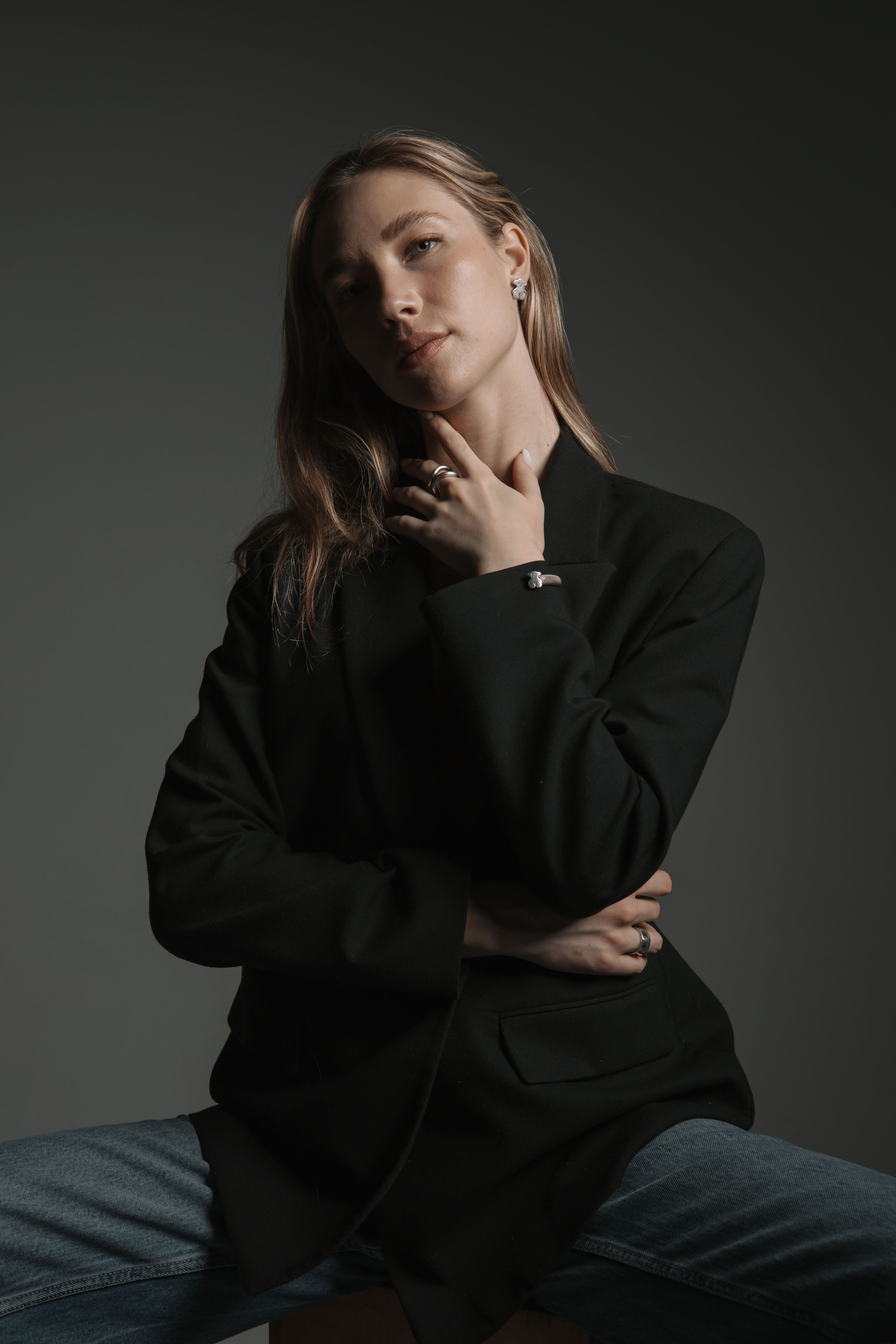 Portrait of Woman Sitting in Jacket · Free Stock Photo