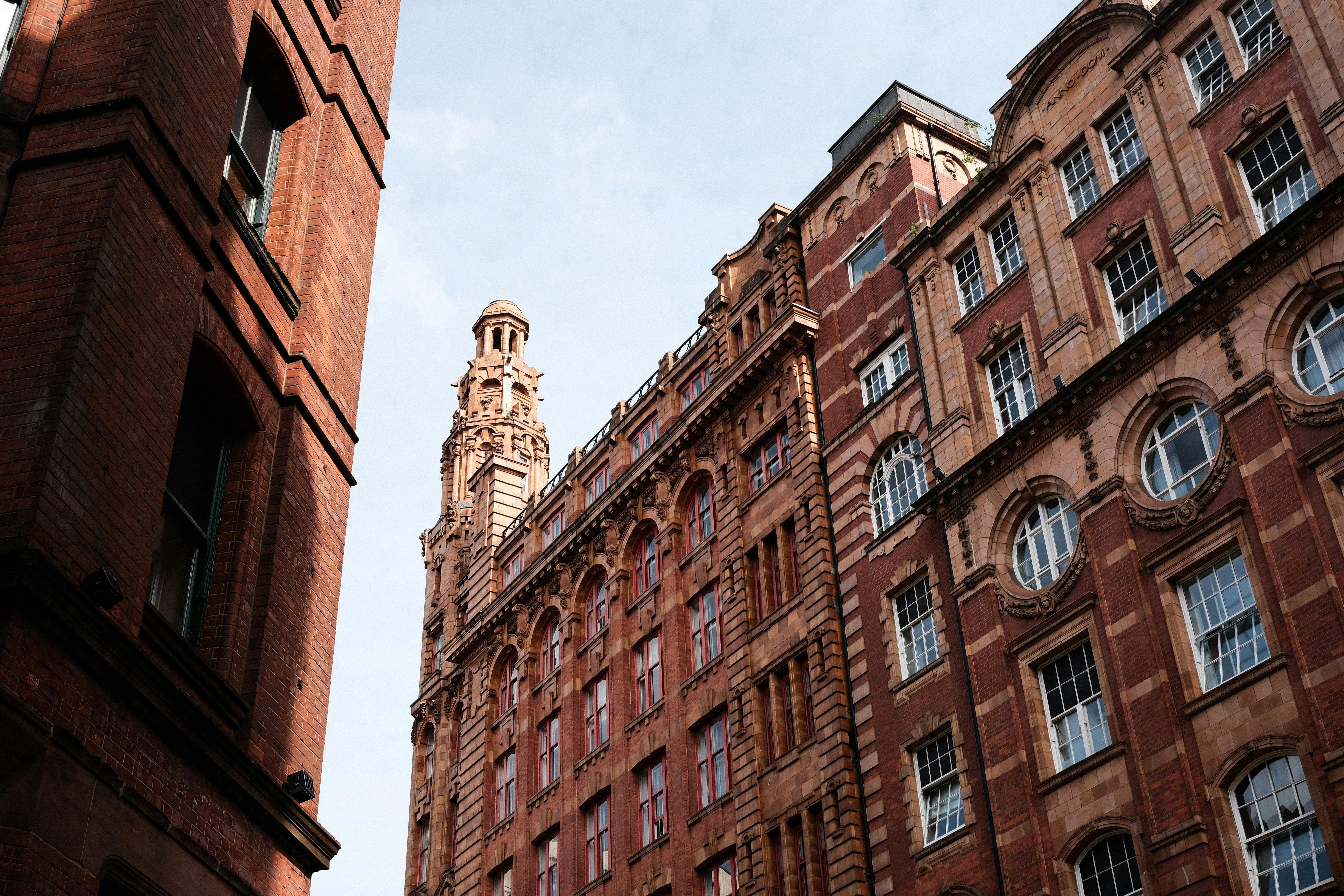Brick Tenements in a Narrow Alley · Free Stock Photo