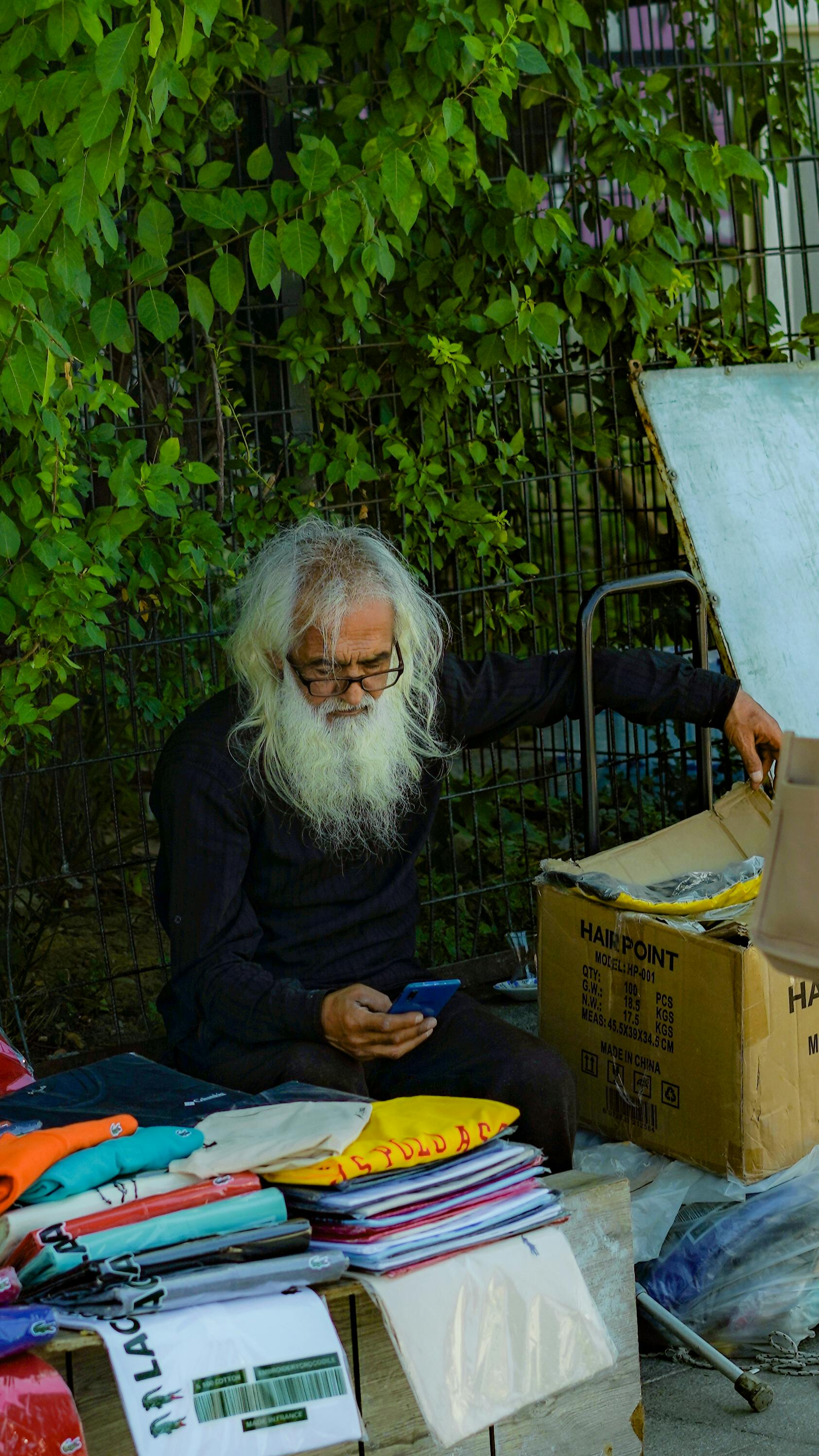 Elderly Man Selling Stuff on Market · Free Stock Photo