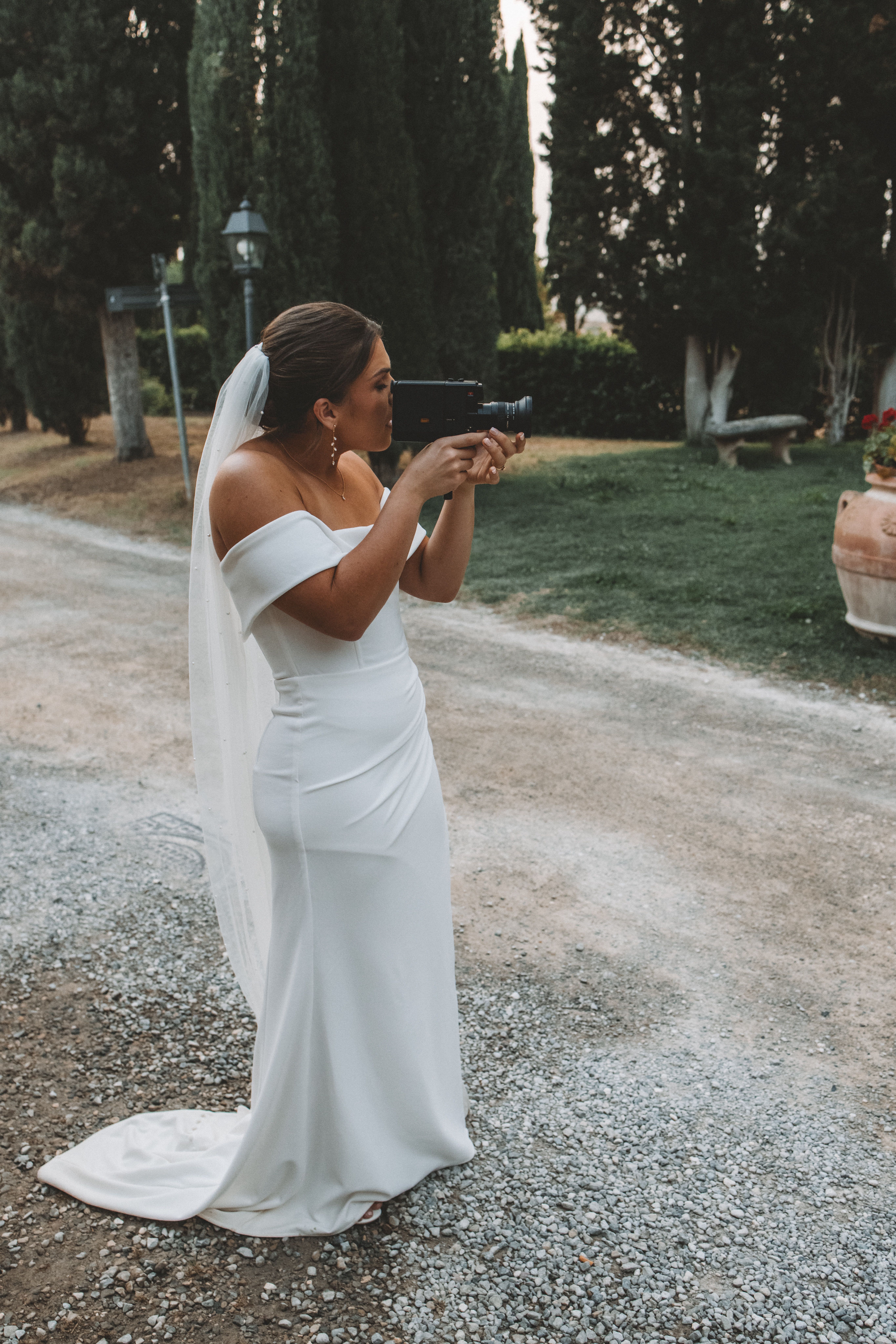 Bride Standing in Wedding Dress and Taking Pictures with Camera · Free ...