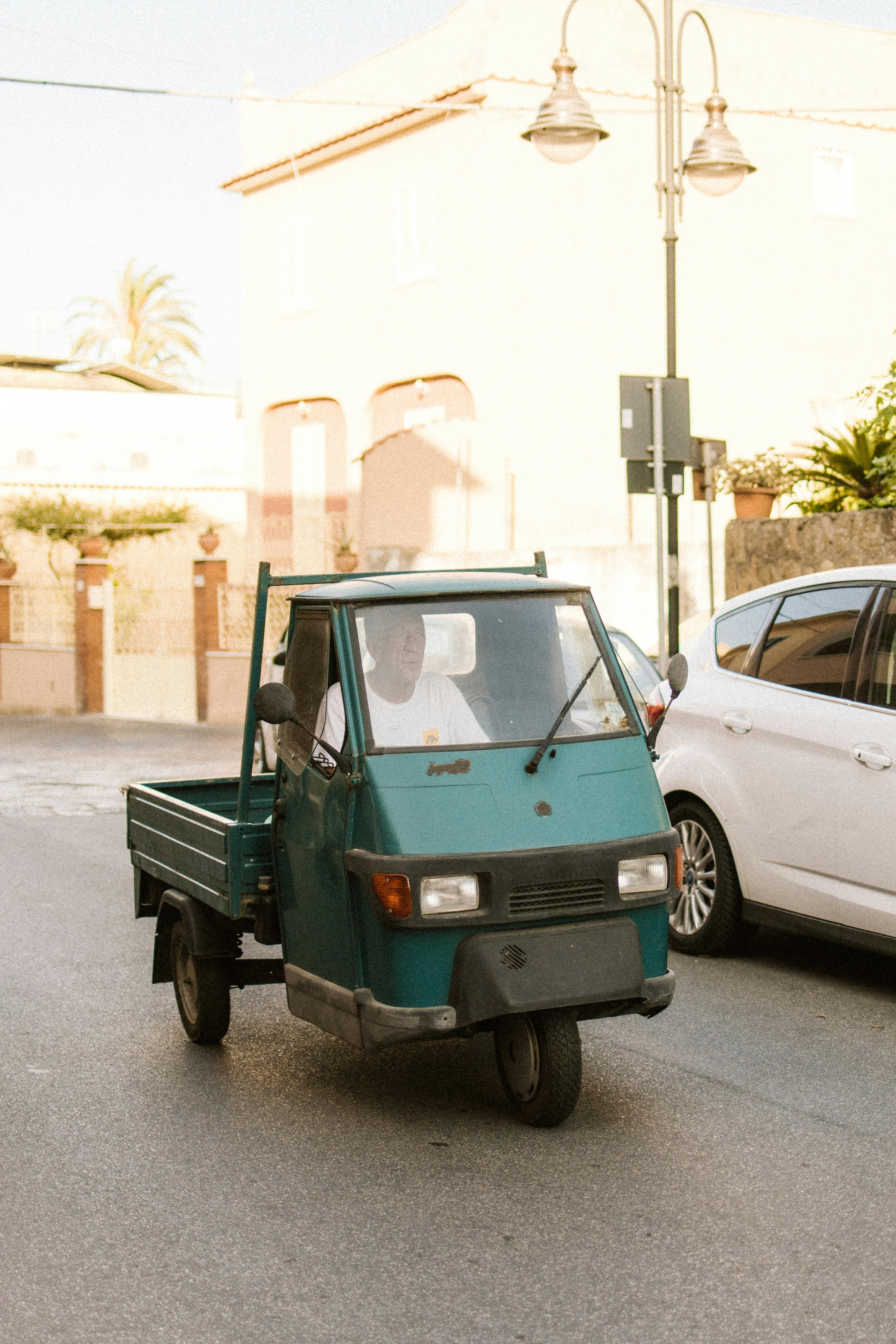 The Piaggio Ape Vehicle on a Road · Free Stock Photo