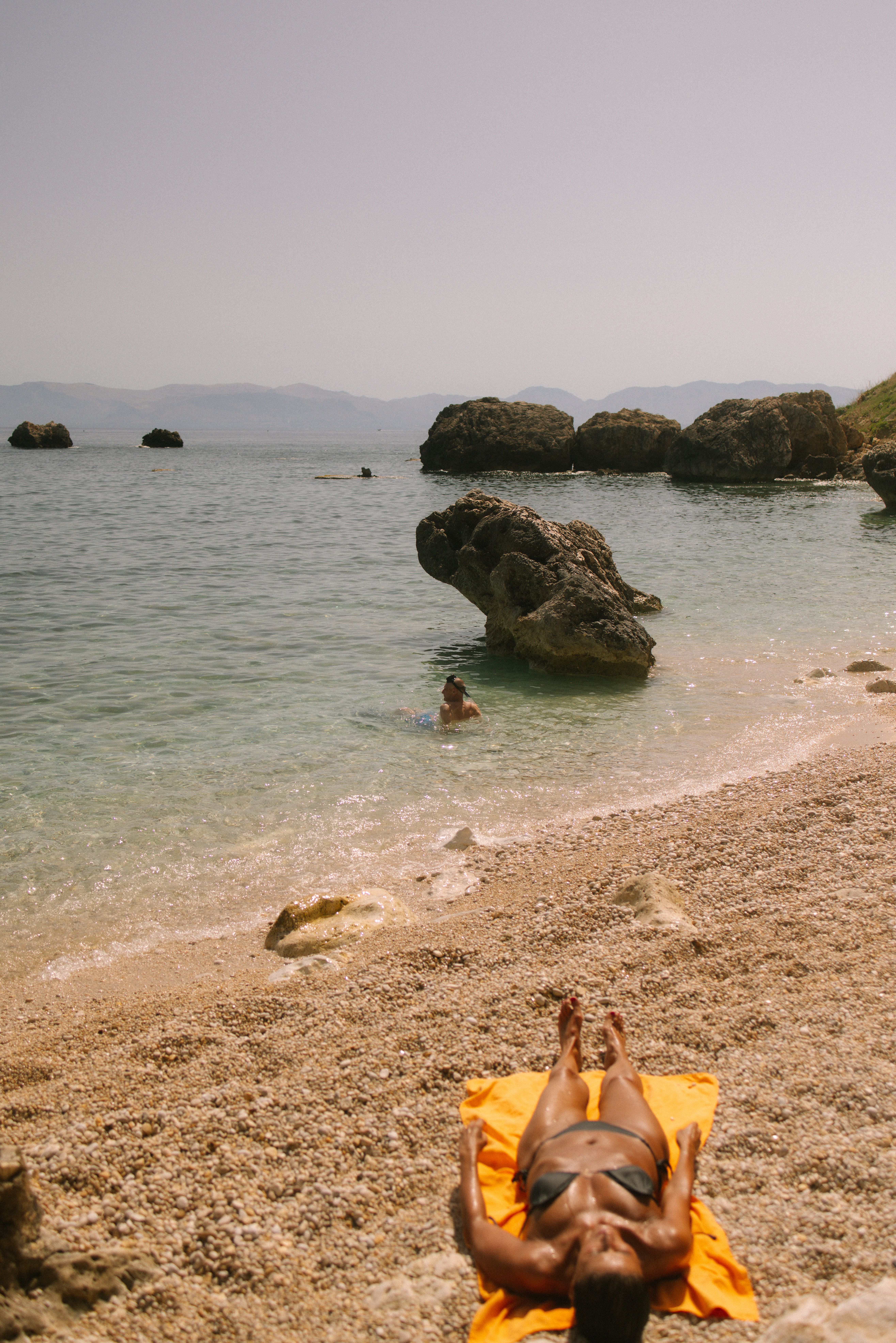 Back View of a Woman Wearing Bikini in the Beach · Free Stock Photo