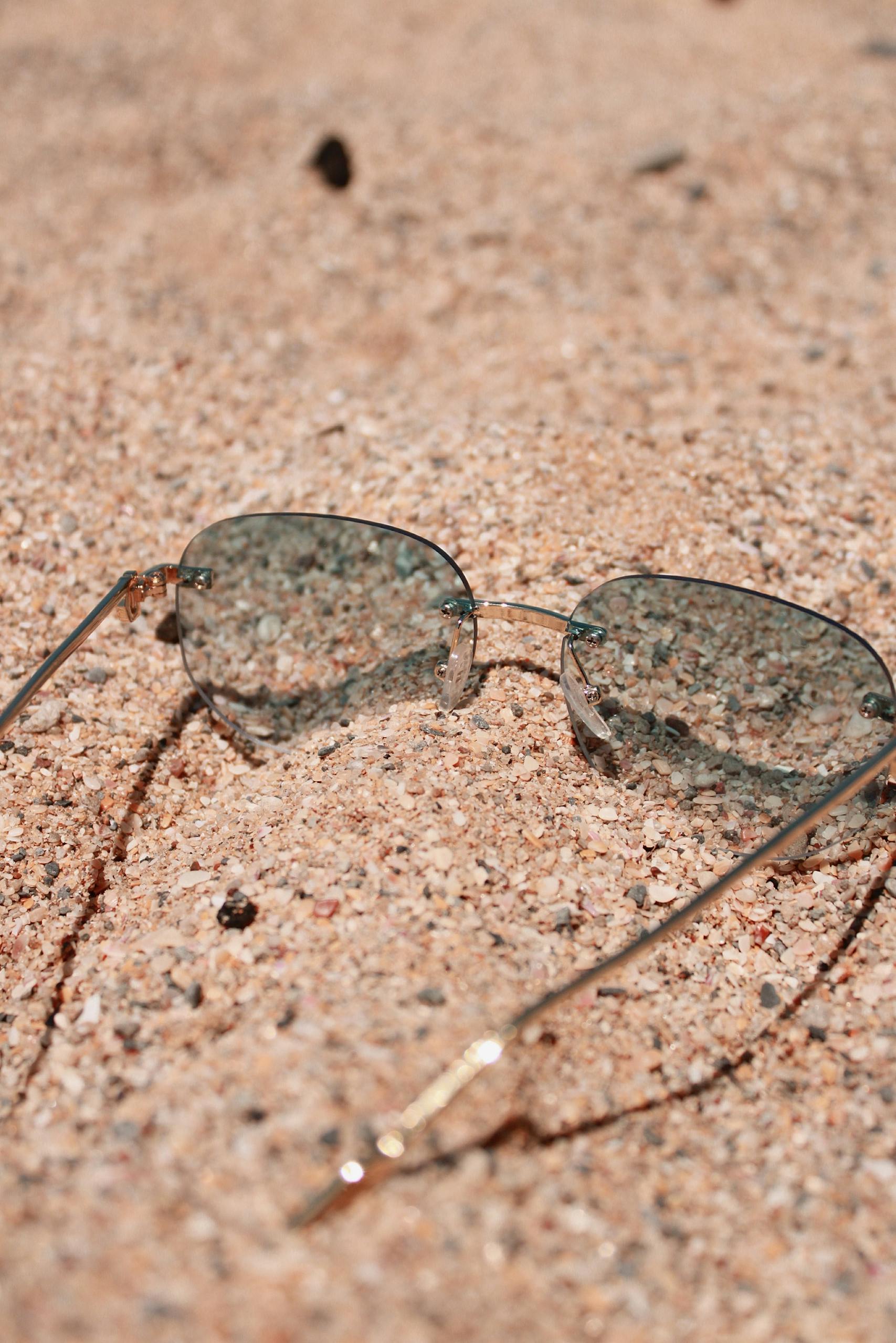 Eyeglasses on Sand · Free Stock Photo
