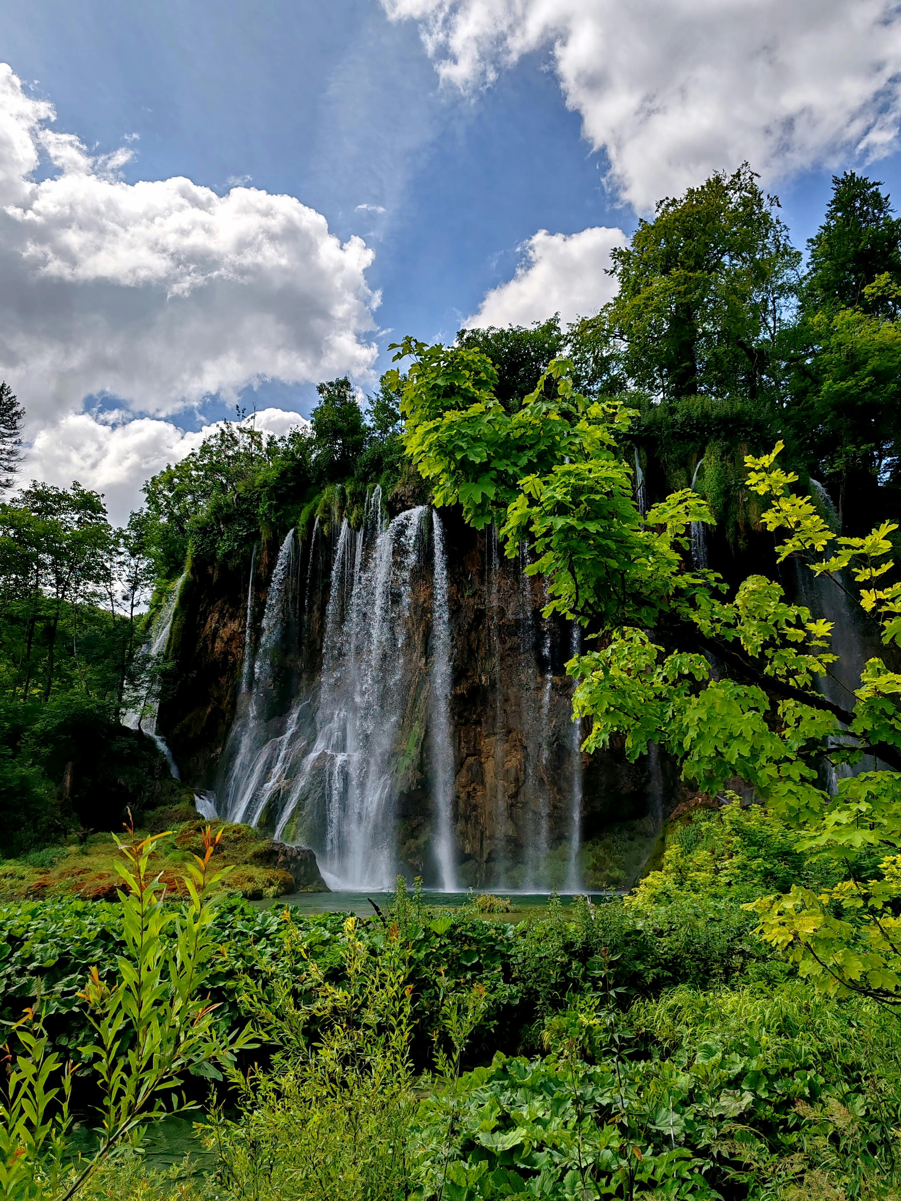 Group of People At A Waterfall · Free Stock Photo