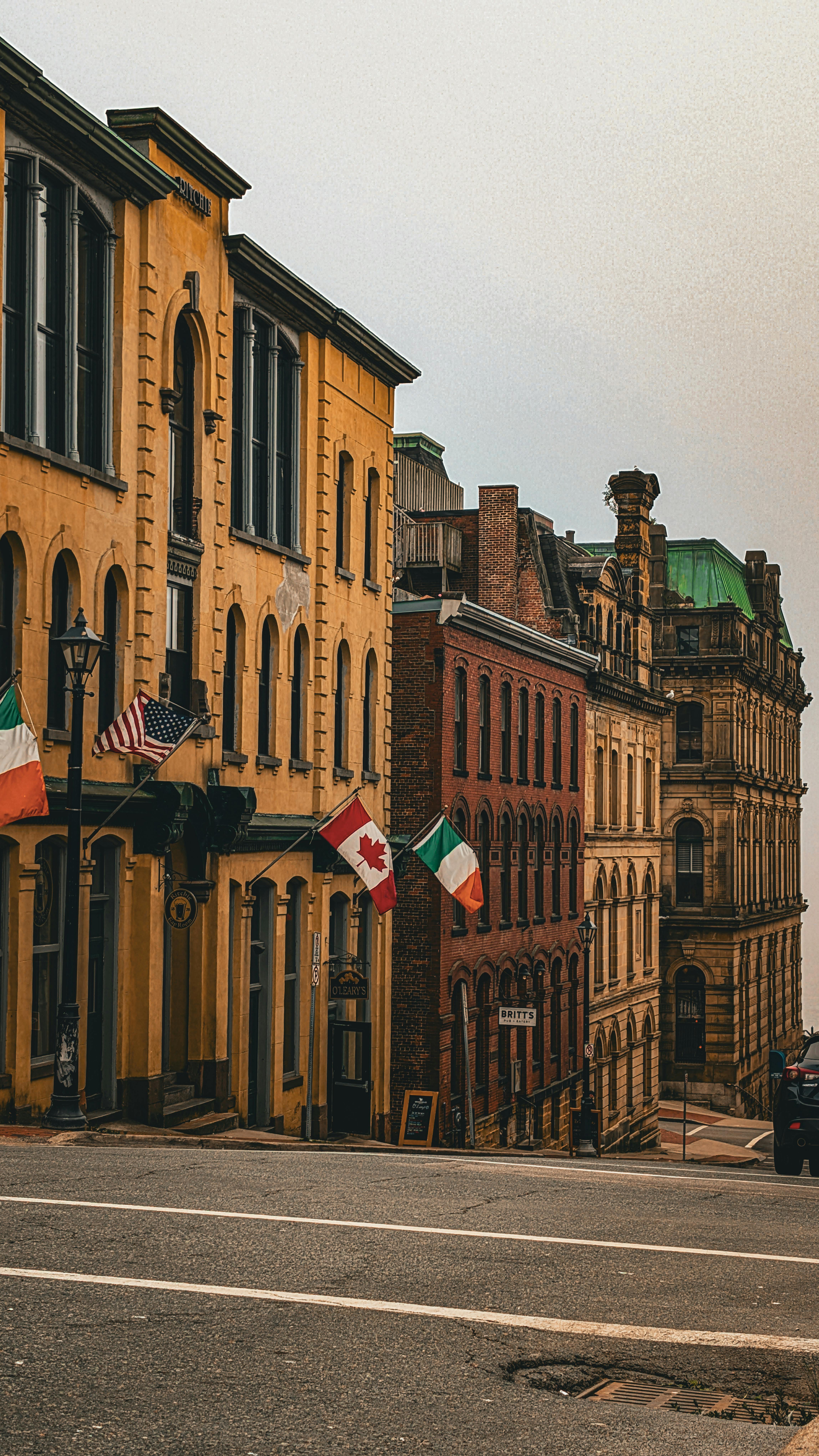 Flags on Buildings Walls · Free Stock Photo