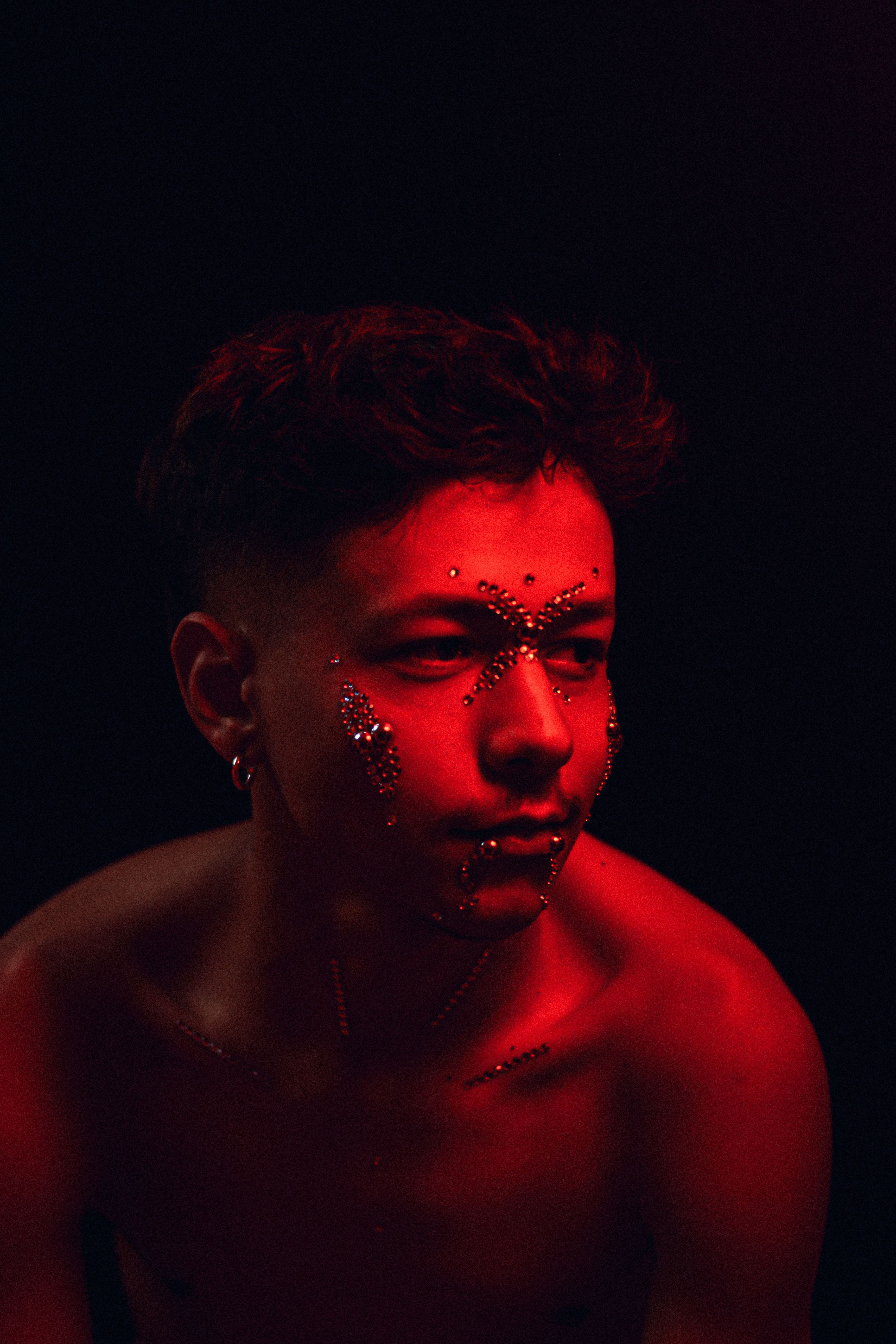 Man with Glister on Face in Red Light · Free Stock Photo