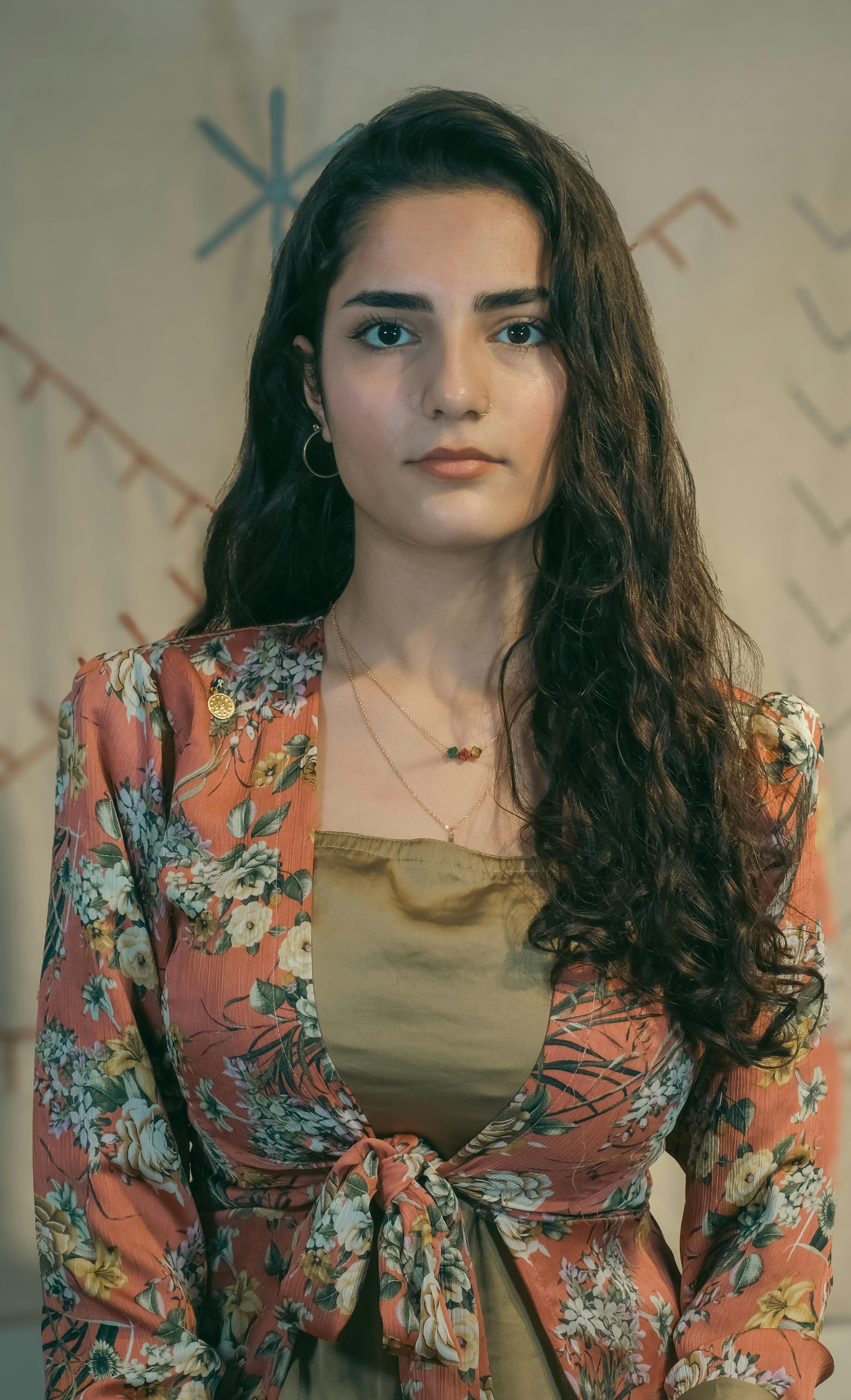 Woman in Floral Tied Blouse and Green Dress · Free Stock Photo